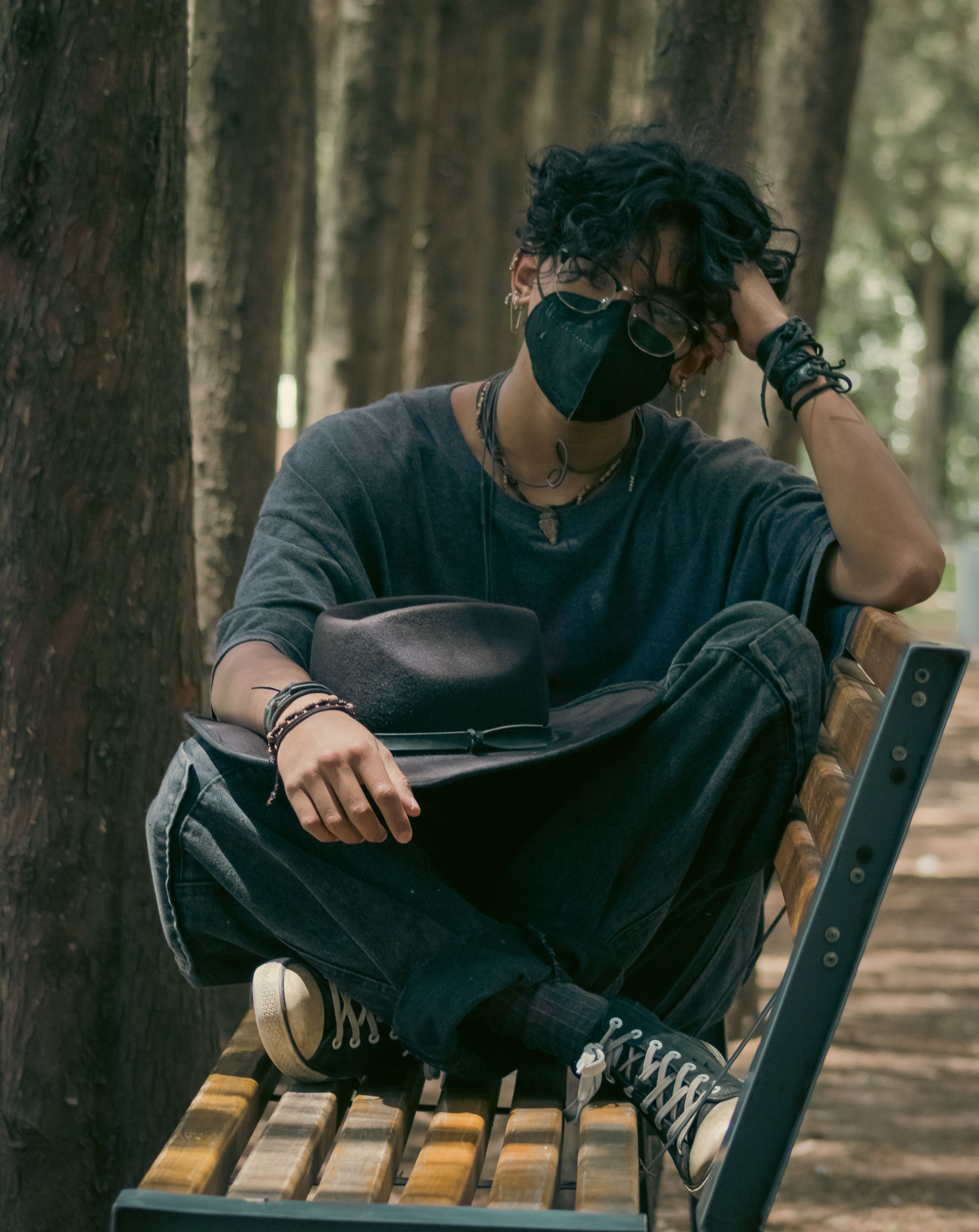 Person Carrying Tree Branches in the Forest · Free Stock Photo
