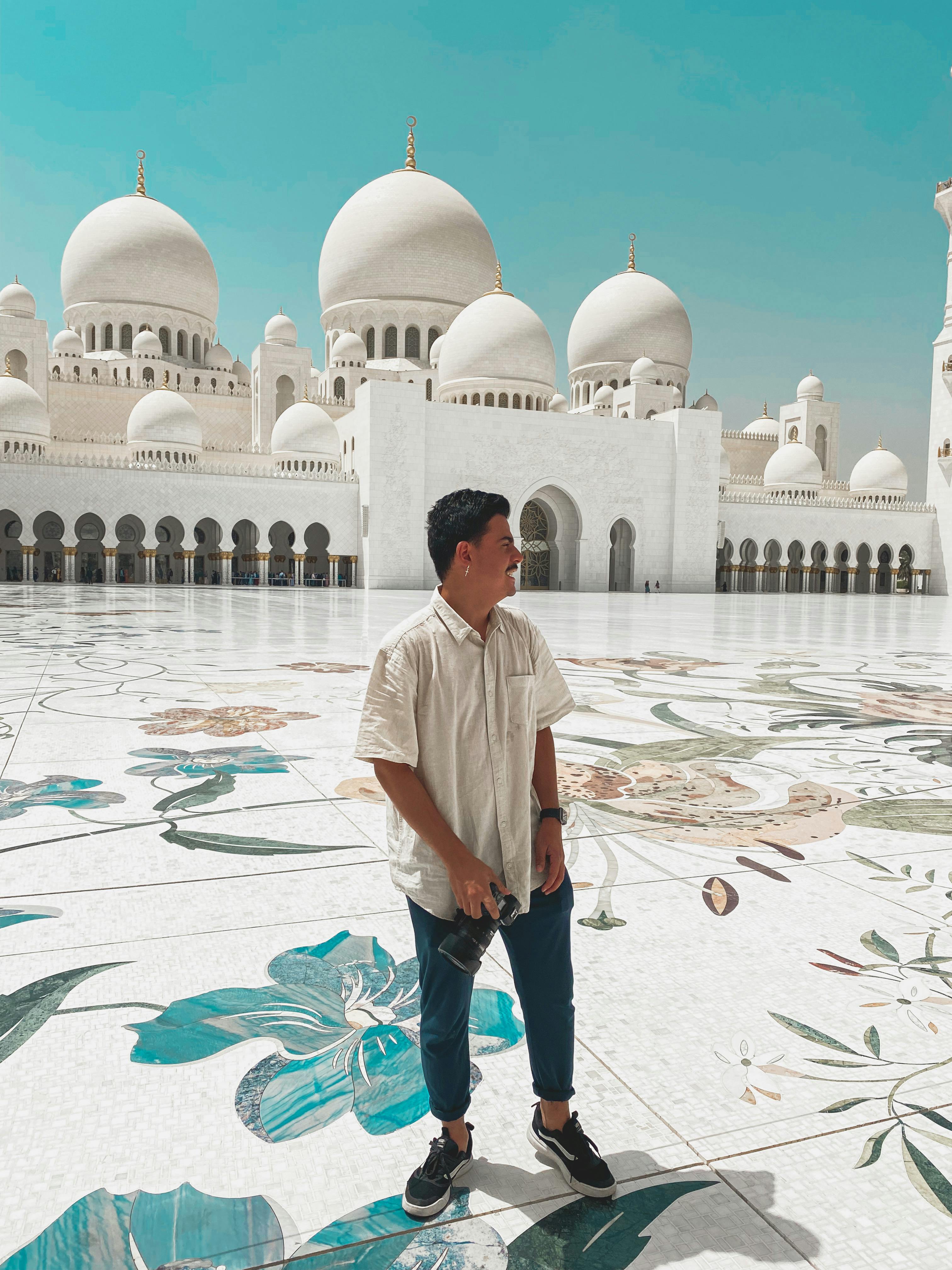 Man in front of Majestic Mosque · Free Stock Photo
