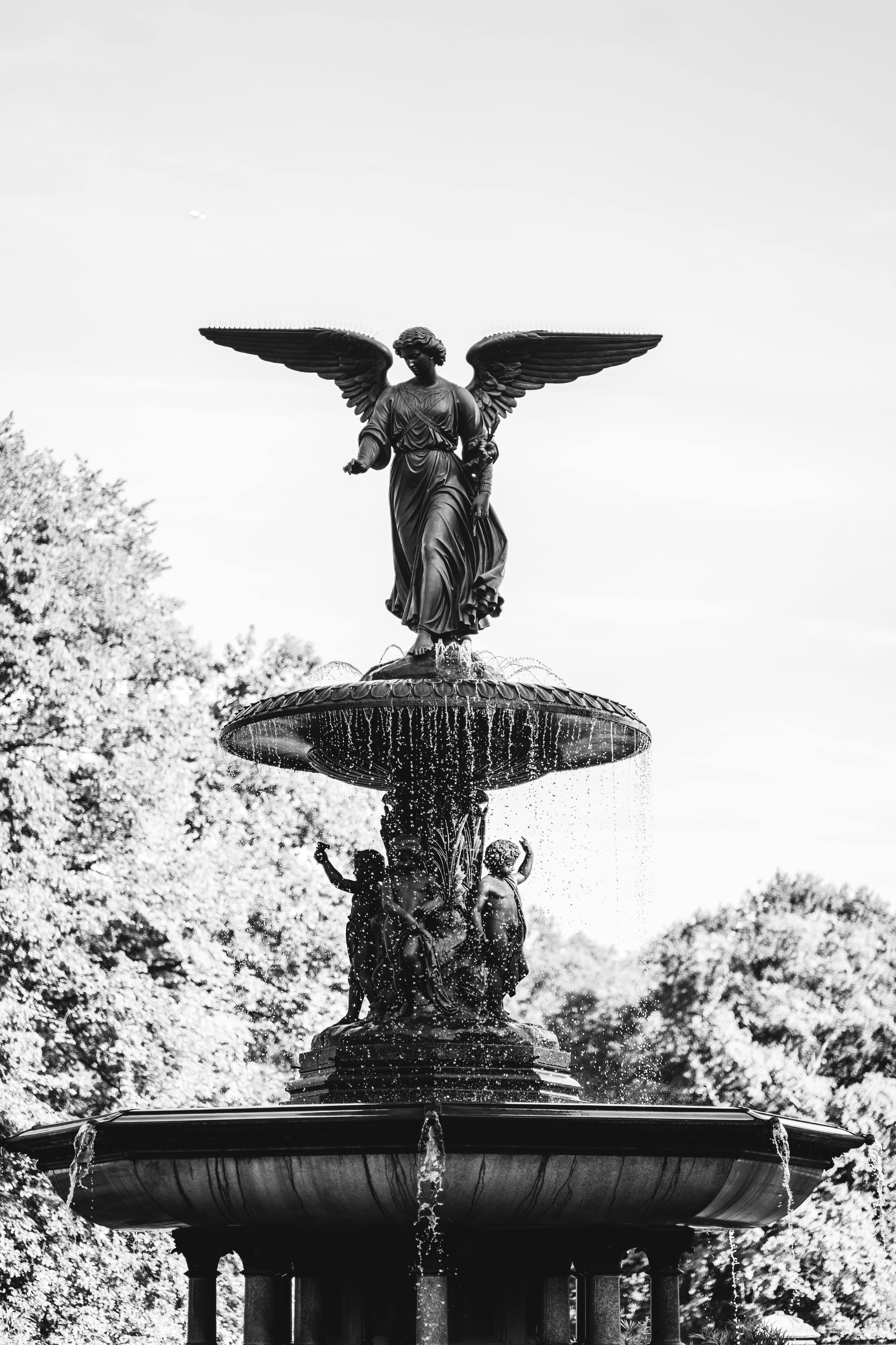 Grayscale Photo of an Angel Water Fountain · Free Stock Photo