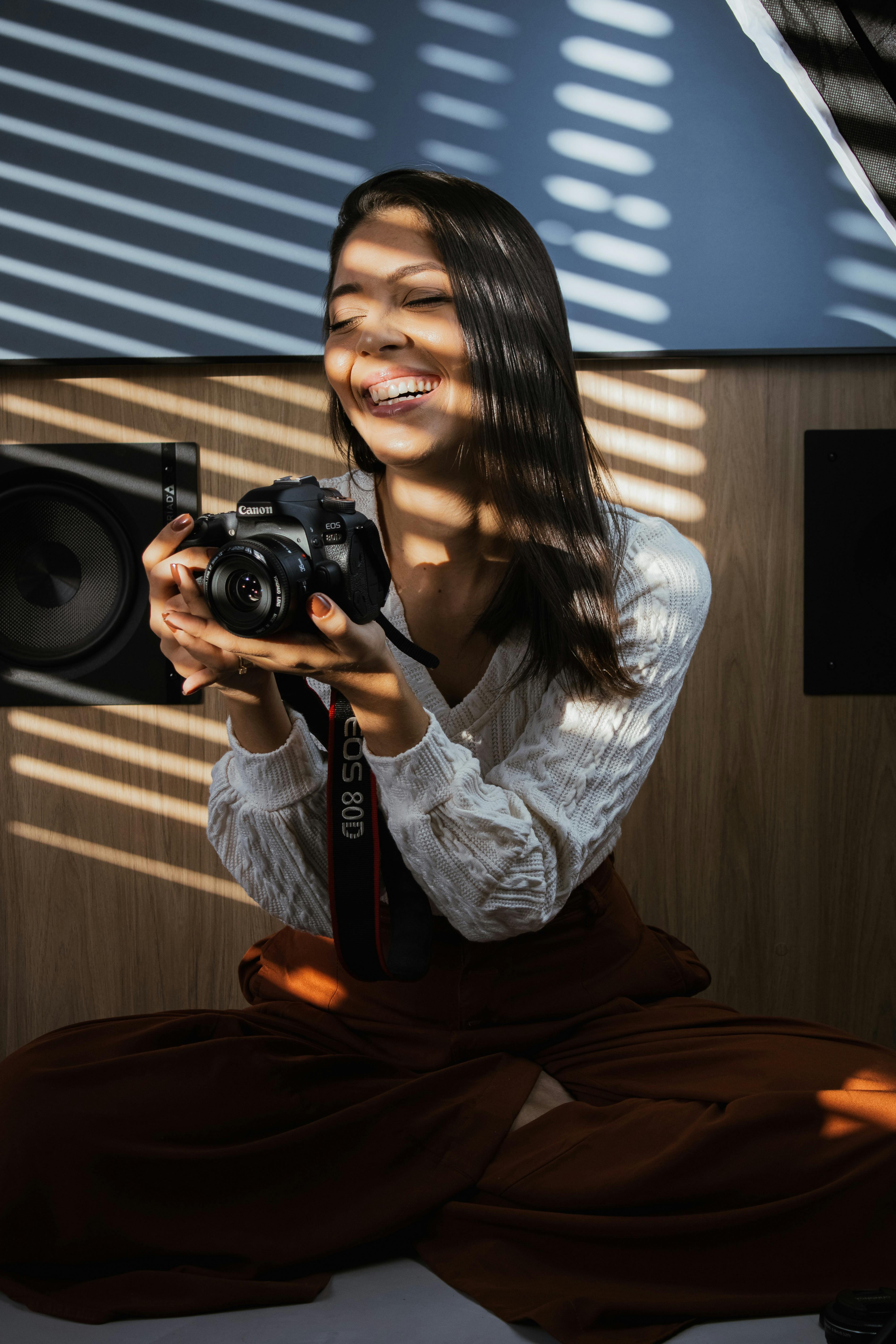 Young Indian photographer showing pictures to the model. Picture ...