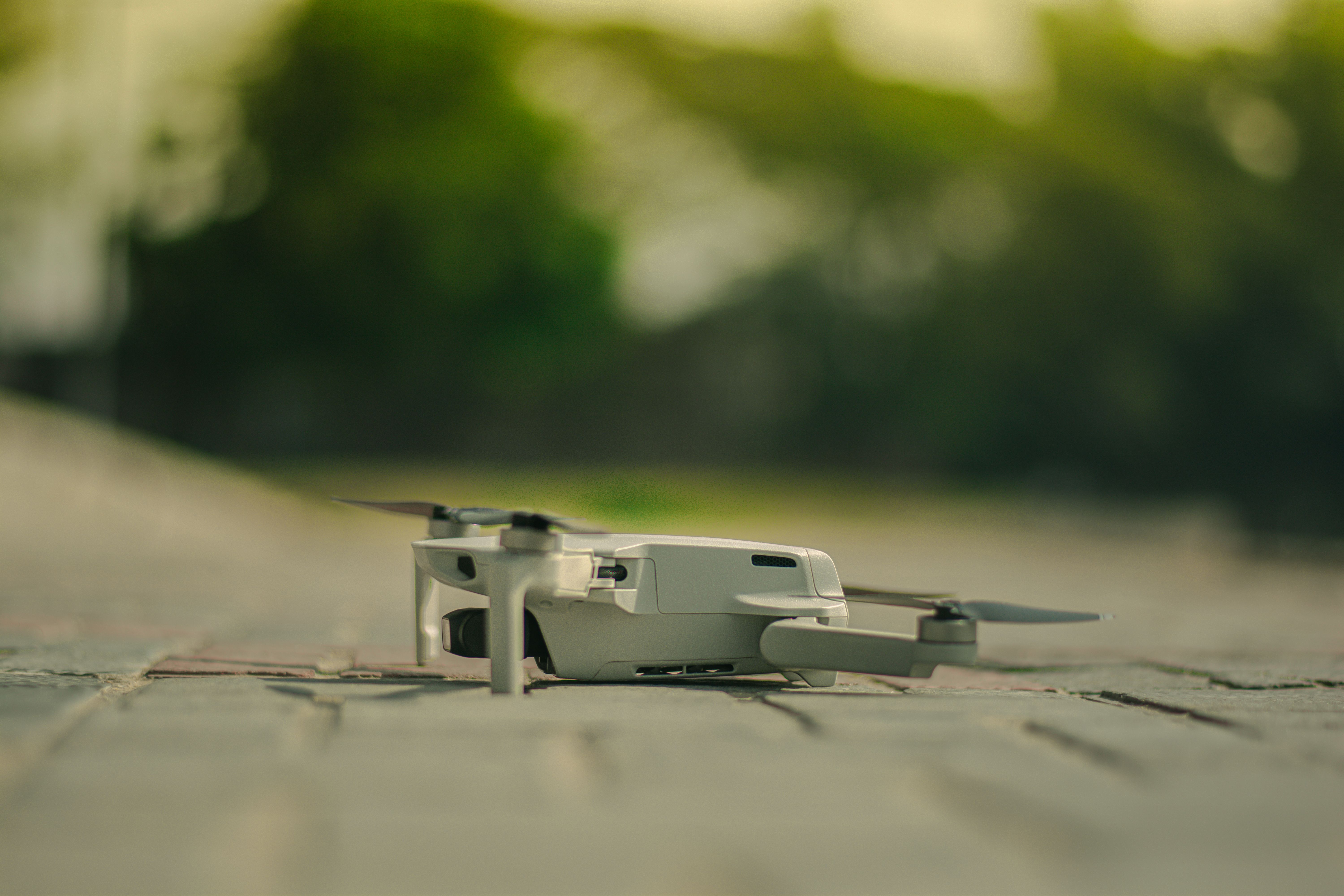 Gray Drone on Concrete Ground · Free Stock Photo