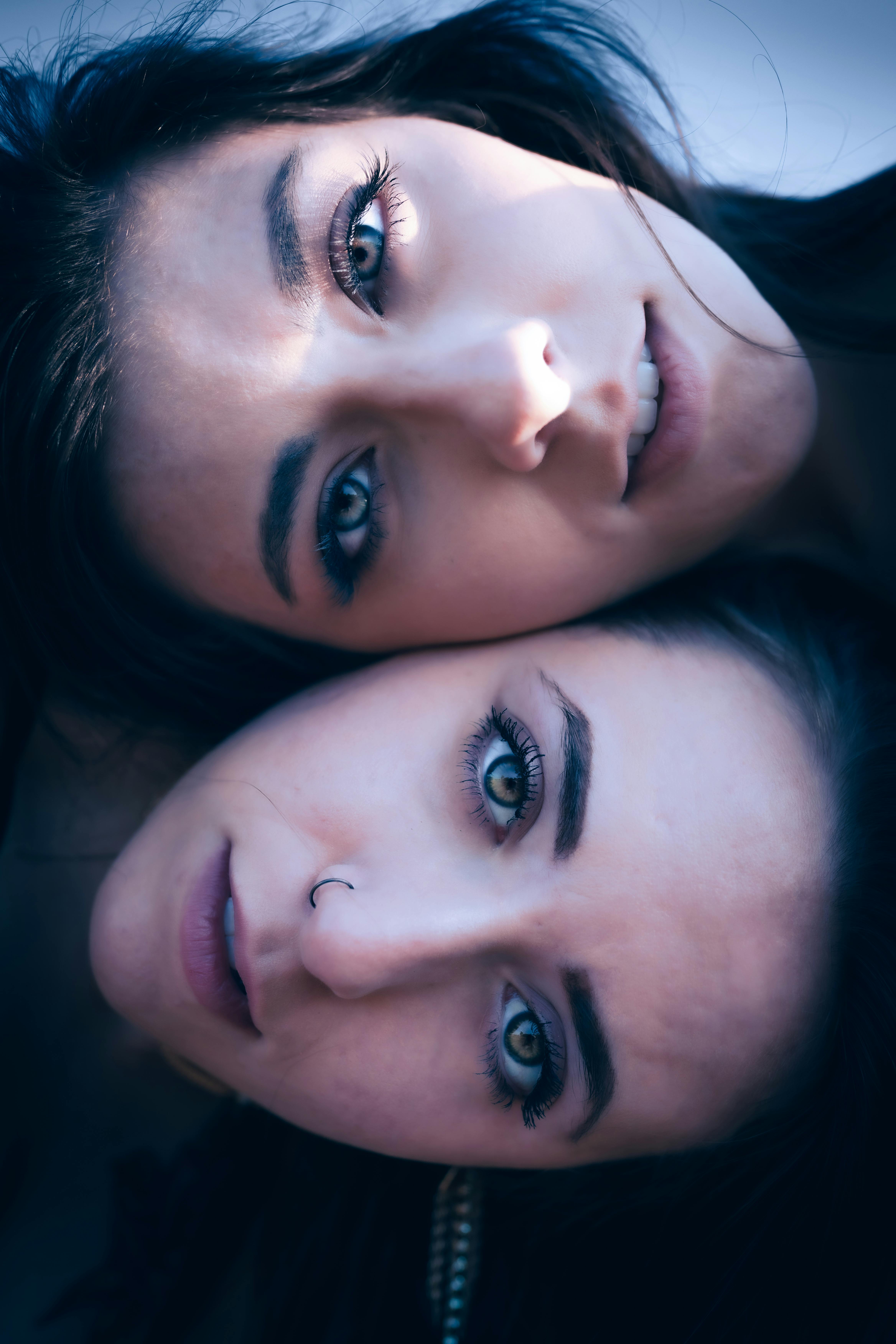 Close-up of Young Woman Putting Her Face on Top of Another · Free Stock ...