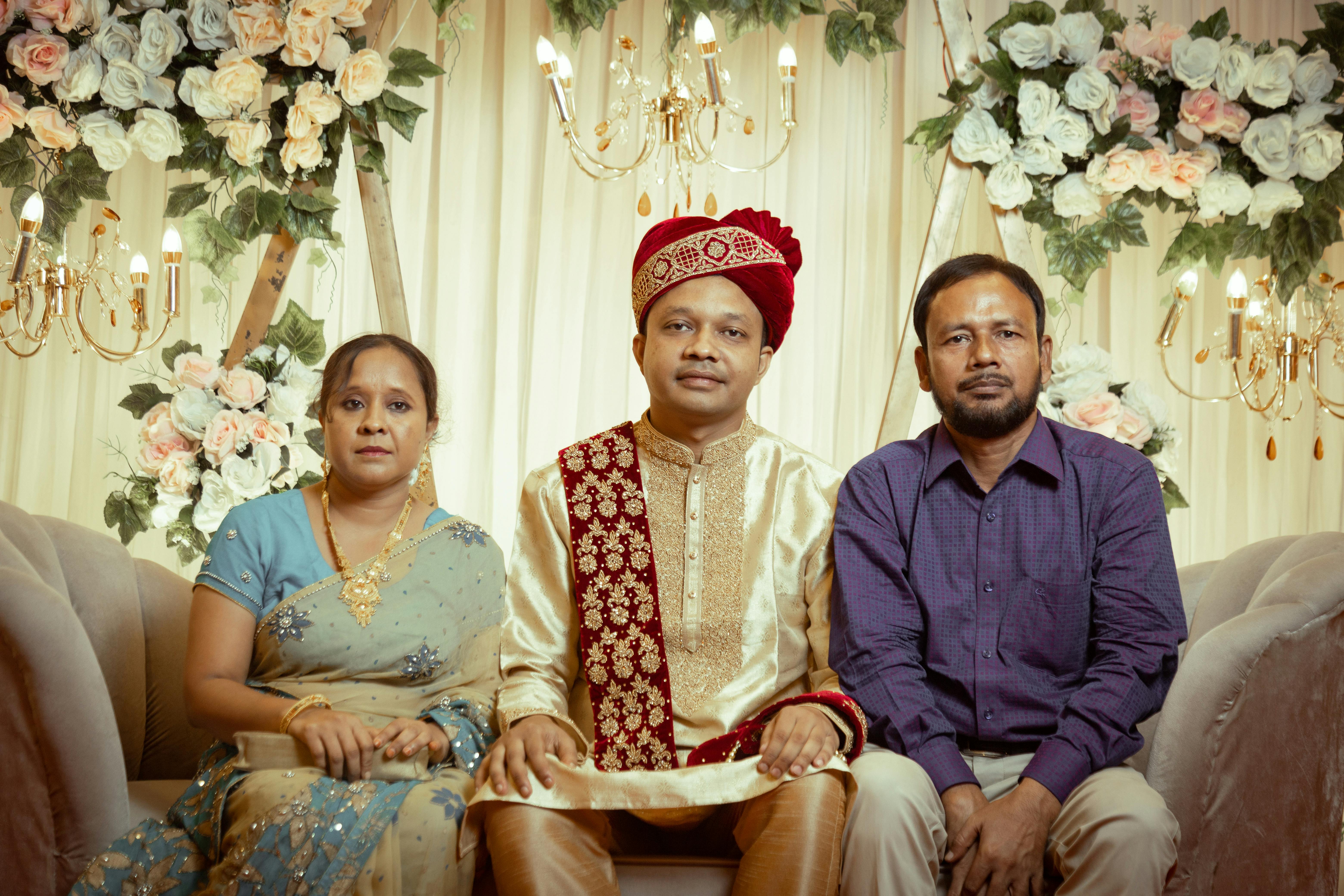 Portrait of People Sitting on a Sofa · Free Stock Photo