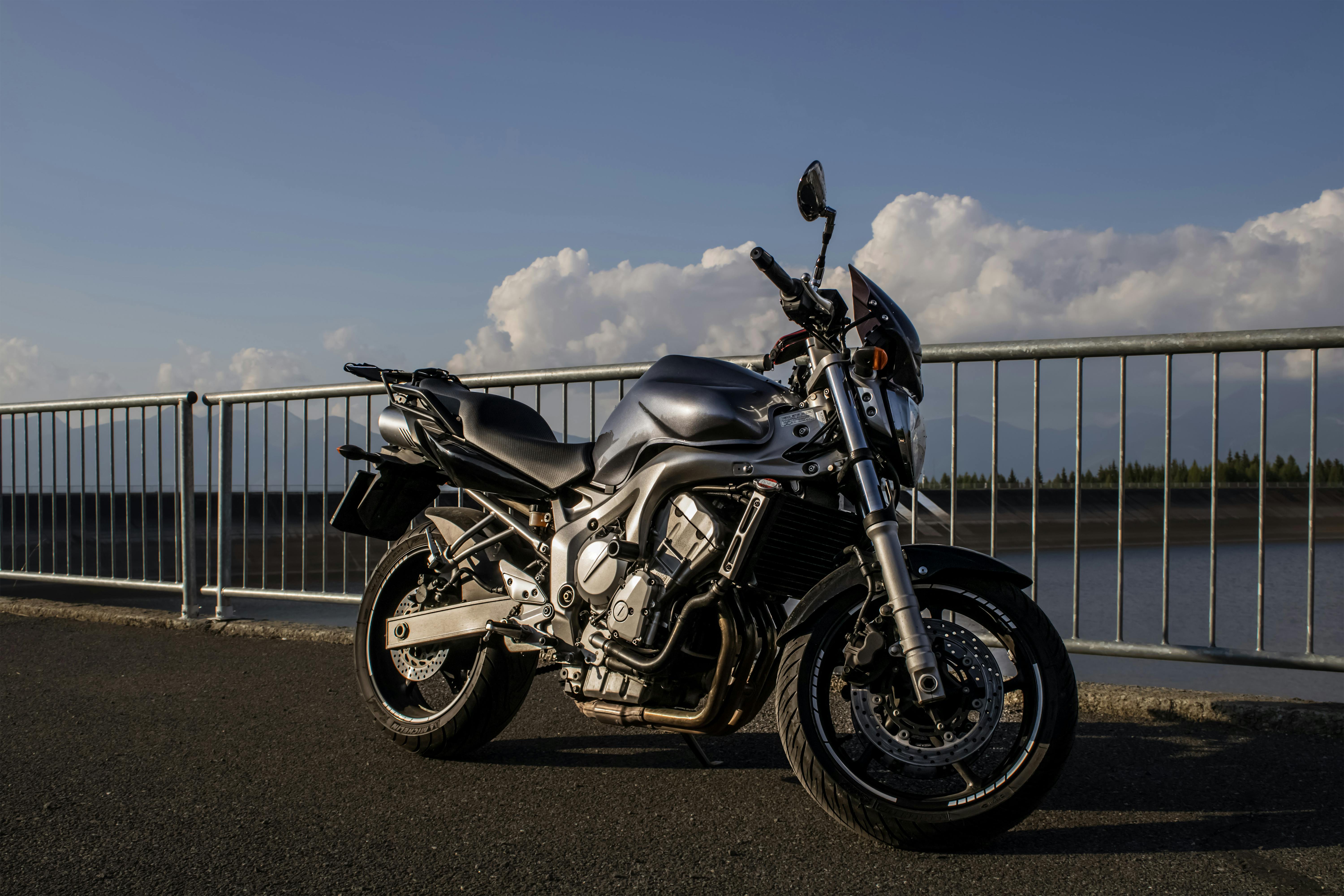 Gray and Silver Cruiser Motorcycle Near Green Grass Lawn · Free Stock Photo