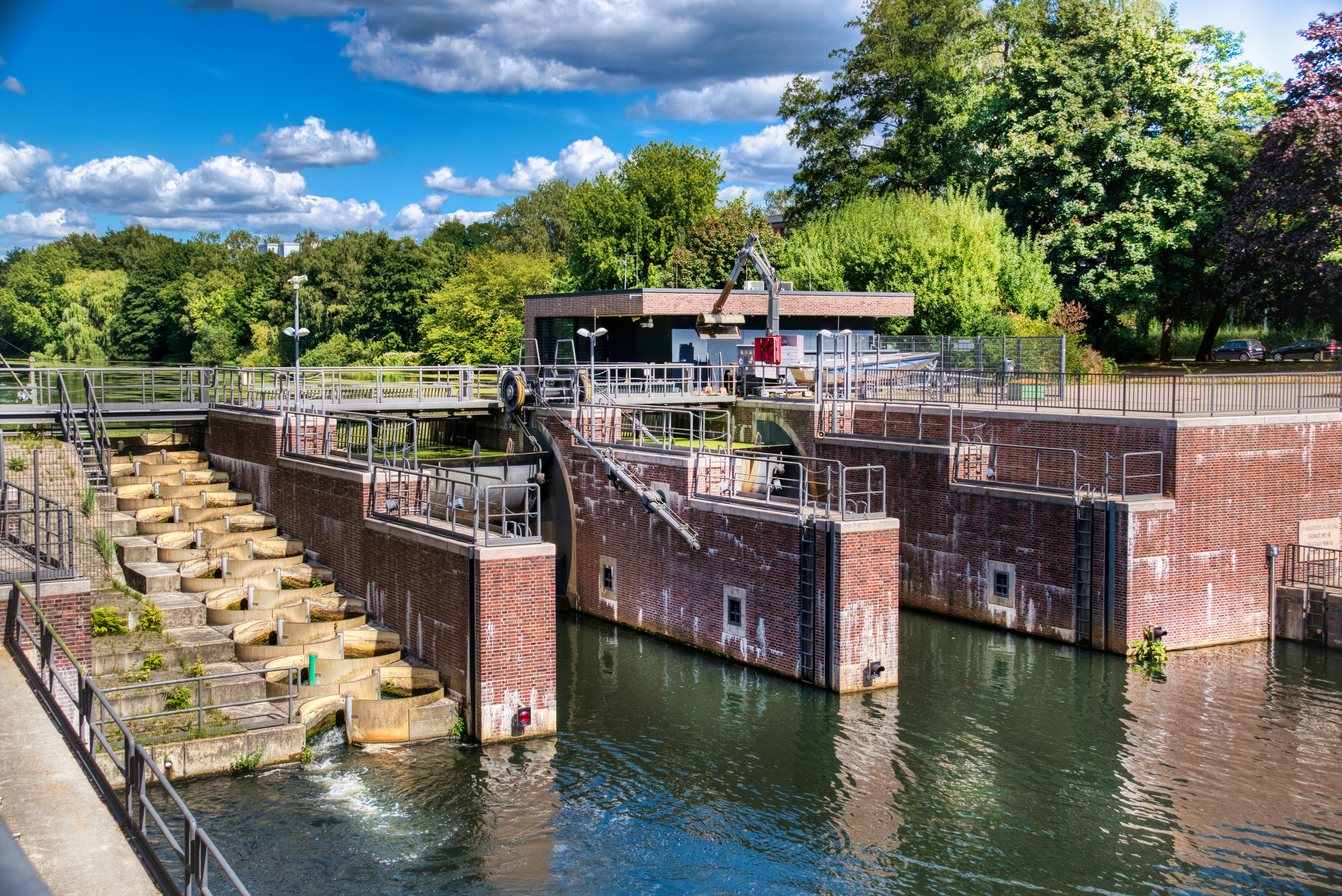 A Water Reservoir Near Green Trees · Free Stock Photo