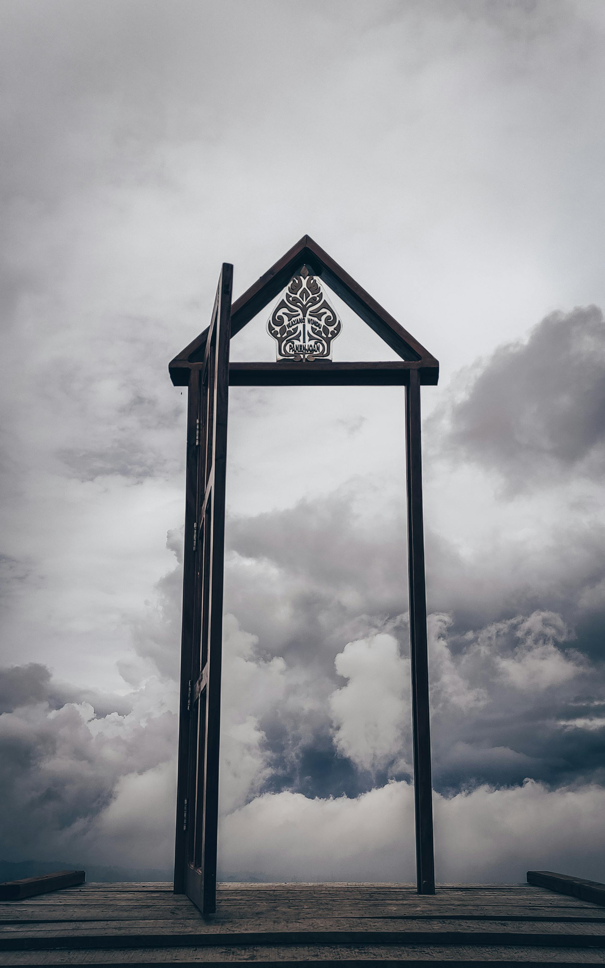 Black and White Street Sign Under Cloudy Sky · Free Stock Photo