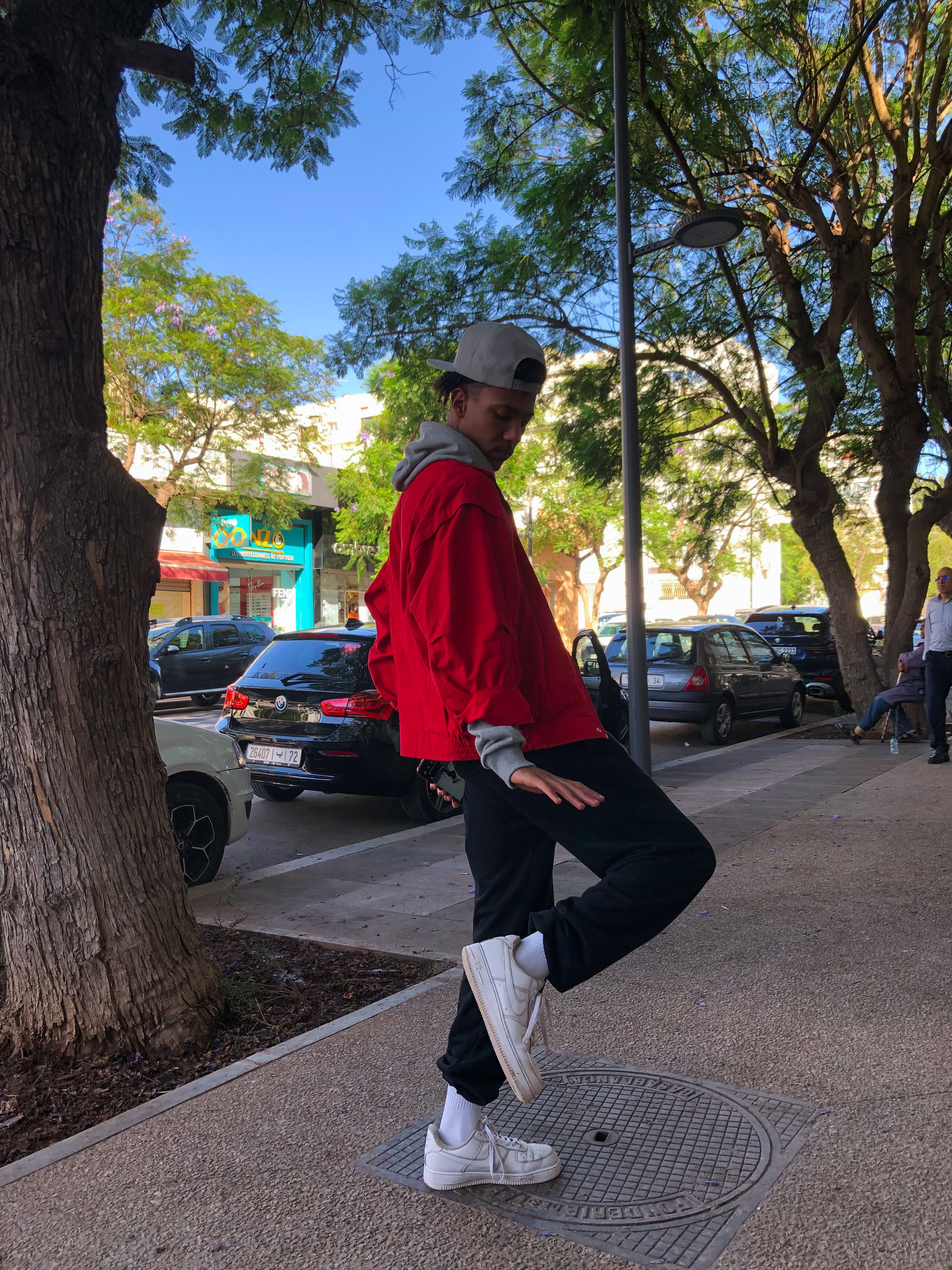 Low-Angle Shot of a Man in Streetwear Clothes · Free Stock Photo