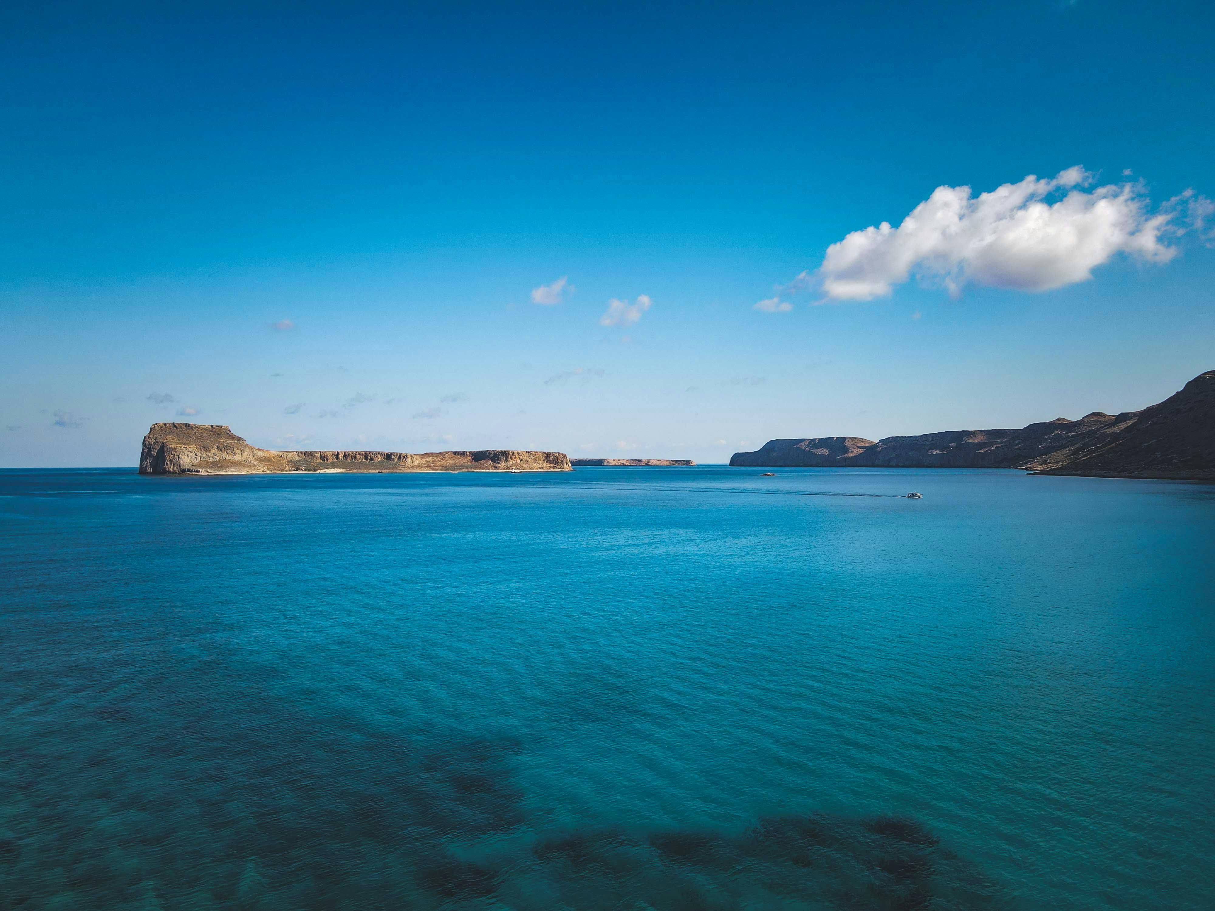 Blue Sea Under Blue Sky · Free Stock Photo