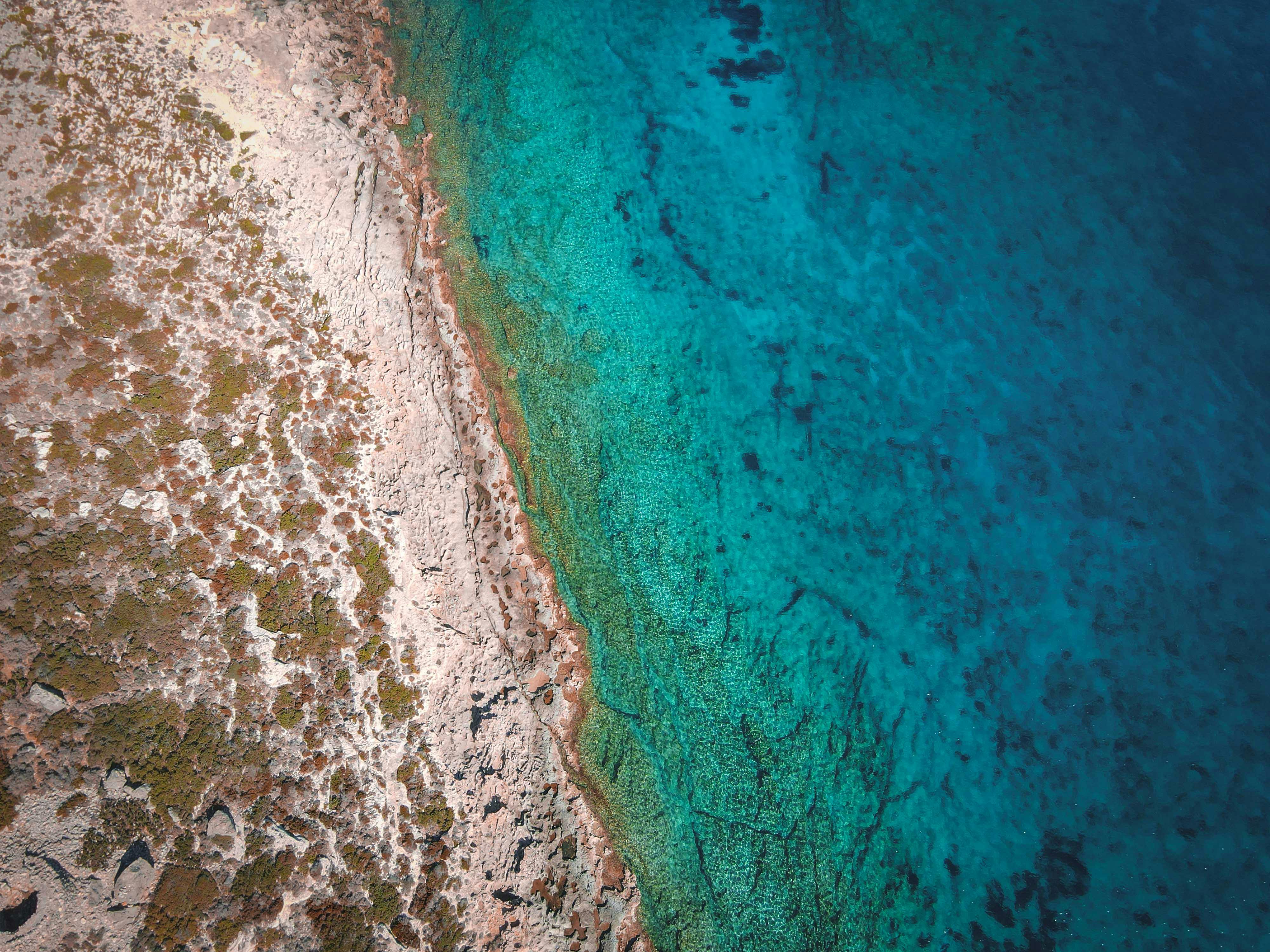Aerial View of an Island and Turquoise Water · Free Stock Photo