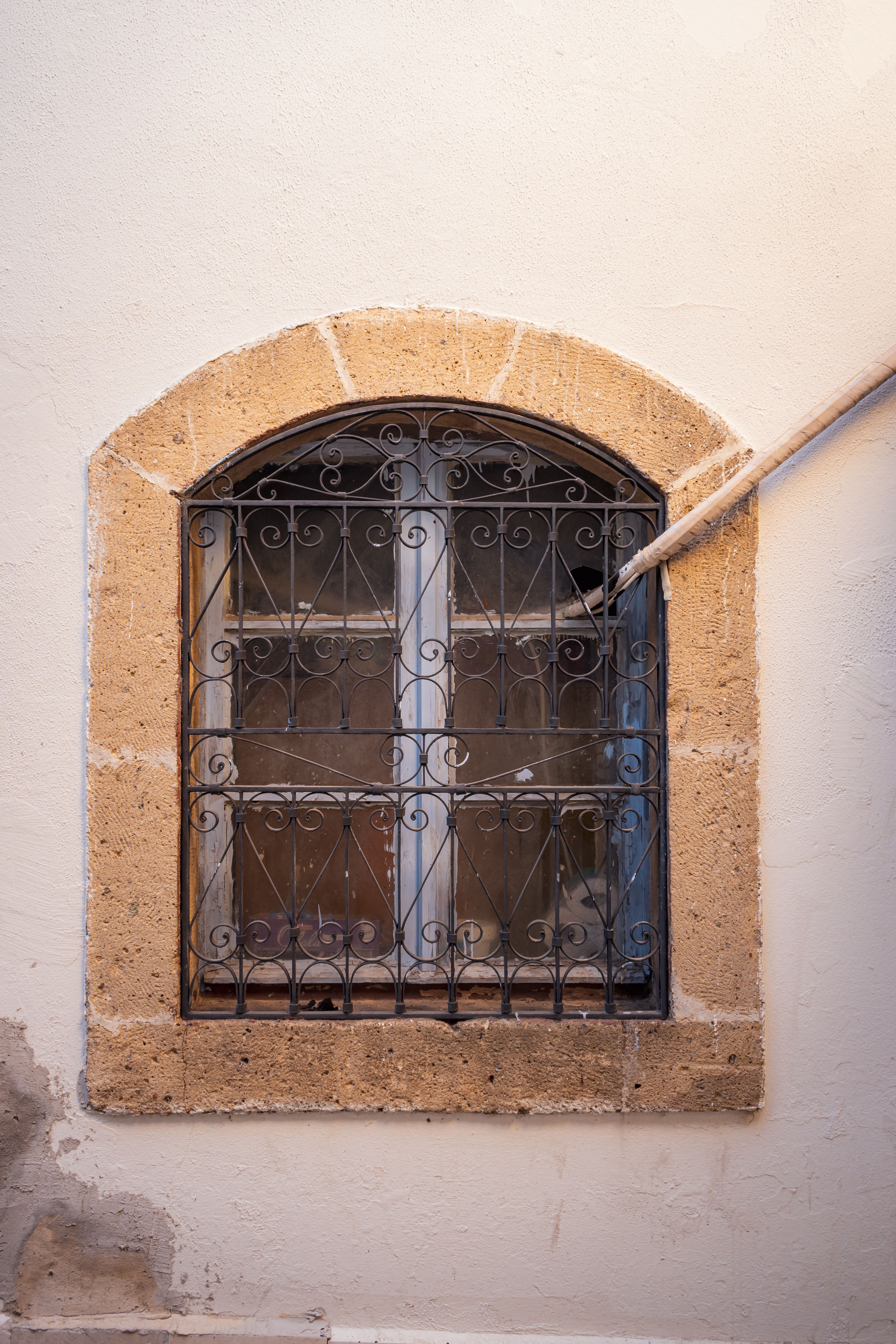 Black Metal Window Frame on White Concrete Wall · Free Stock Photo