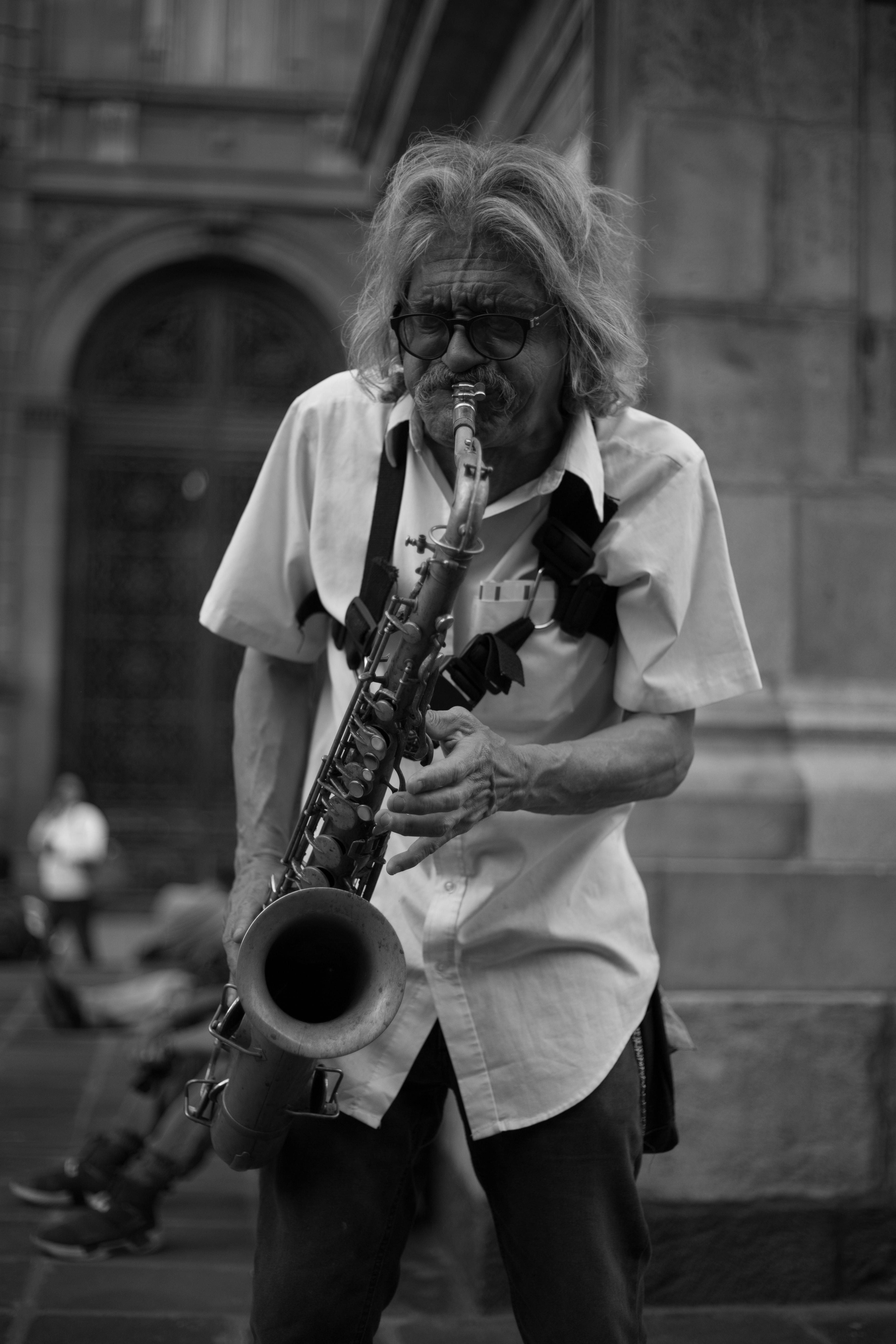 Silhouette of Man Playing Saxophone in Black and White · Free Stock Photo