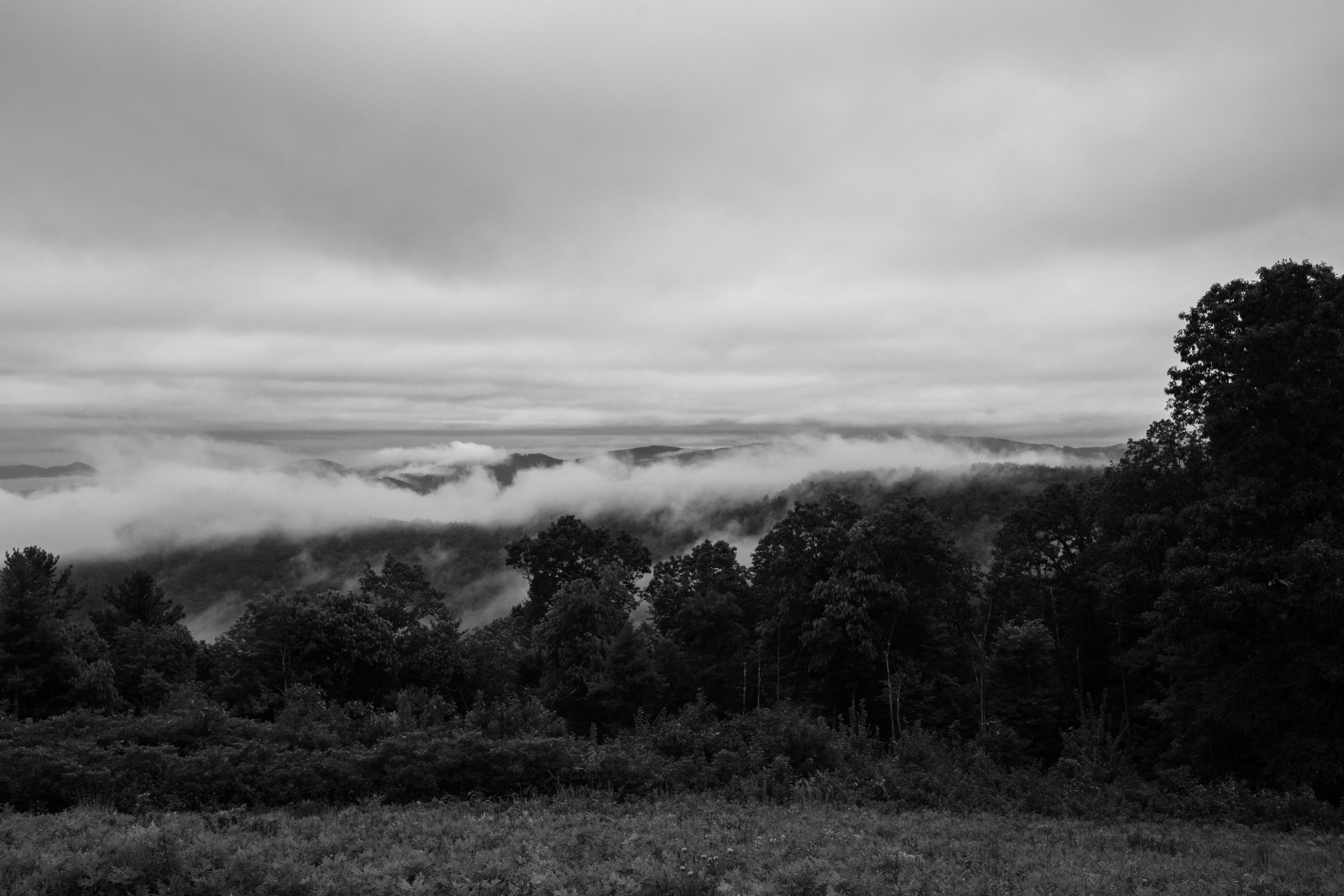 Grayscale Photo of a Snow Capped Mountain Under Cloudy Sky · Free Stock ...