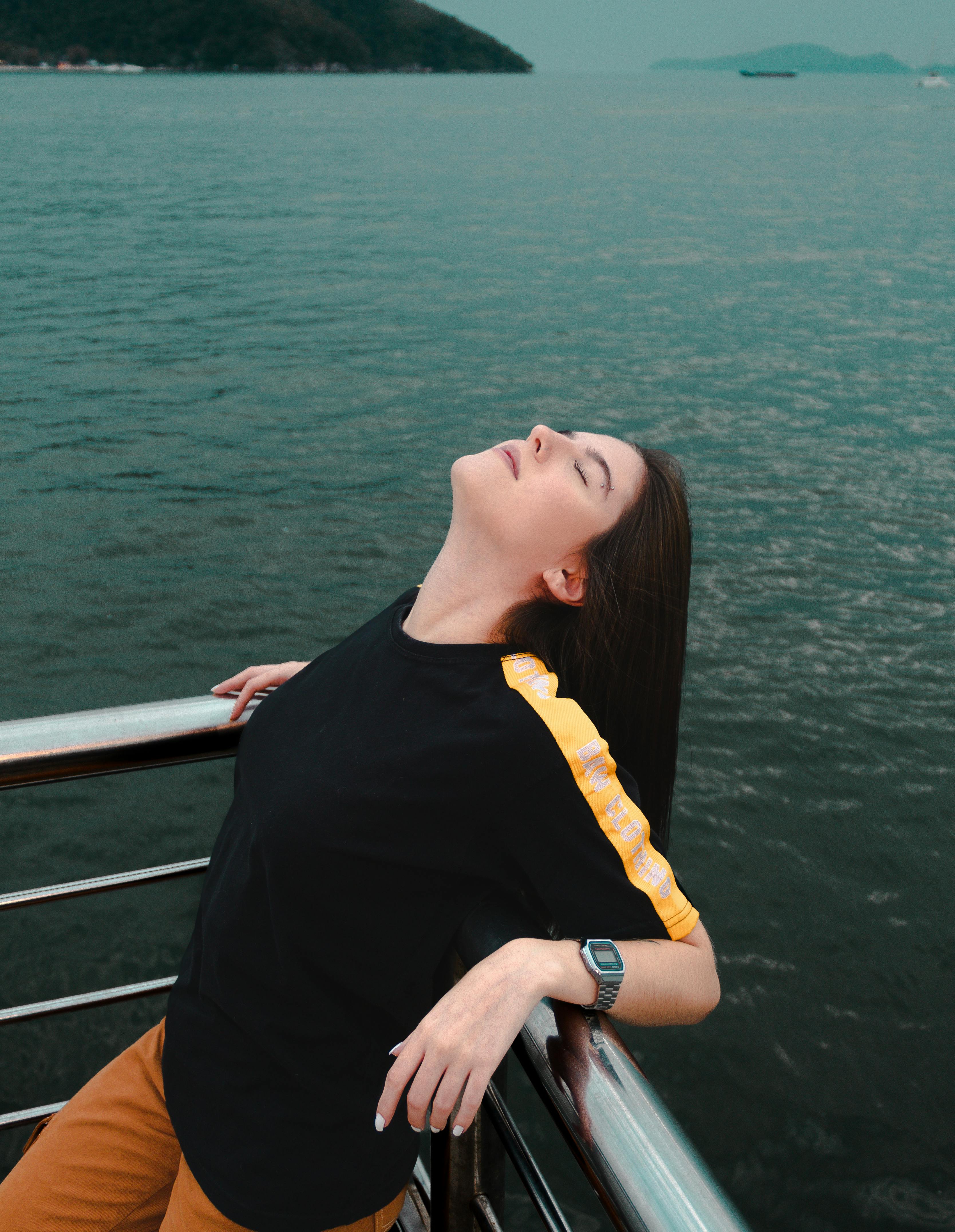 Woman Reaching Above the Railing · Free Stock Photo