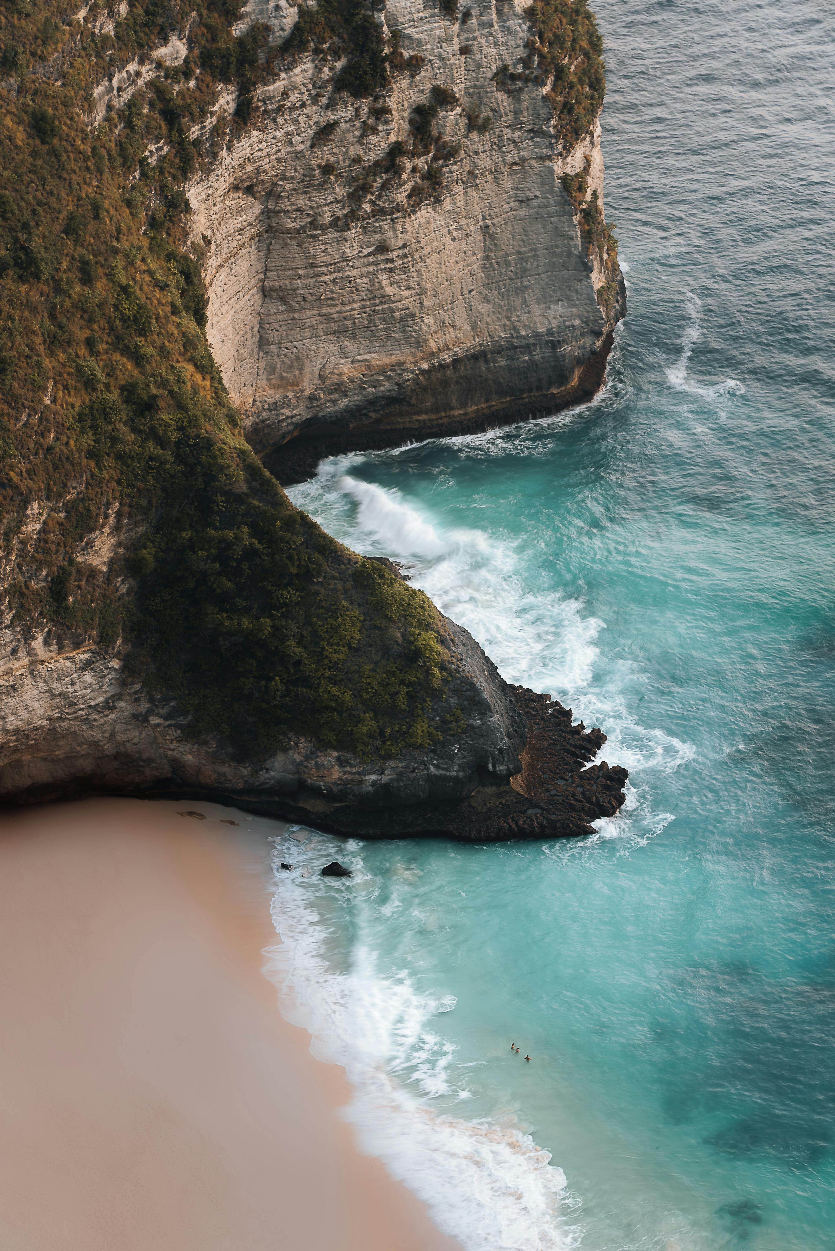Beach and Cliff on Sea Shore · Free Stock Photo