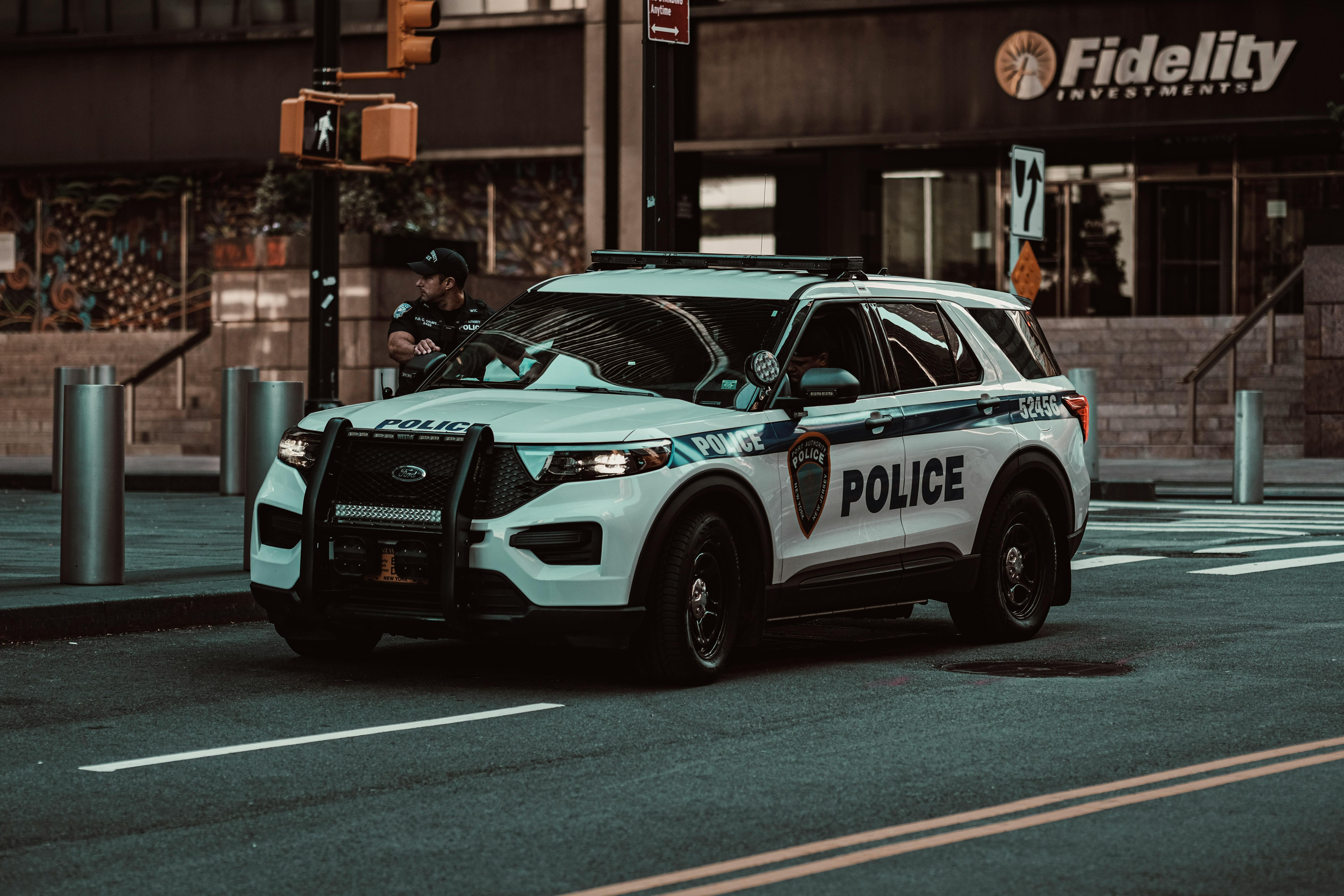 A Police Car Parked on the Roadside · Free Stock Photo