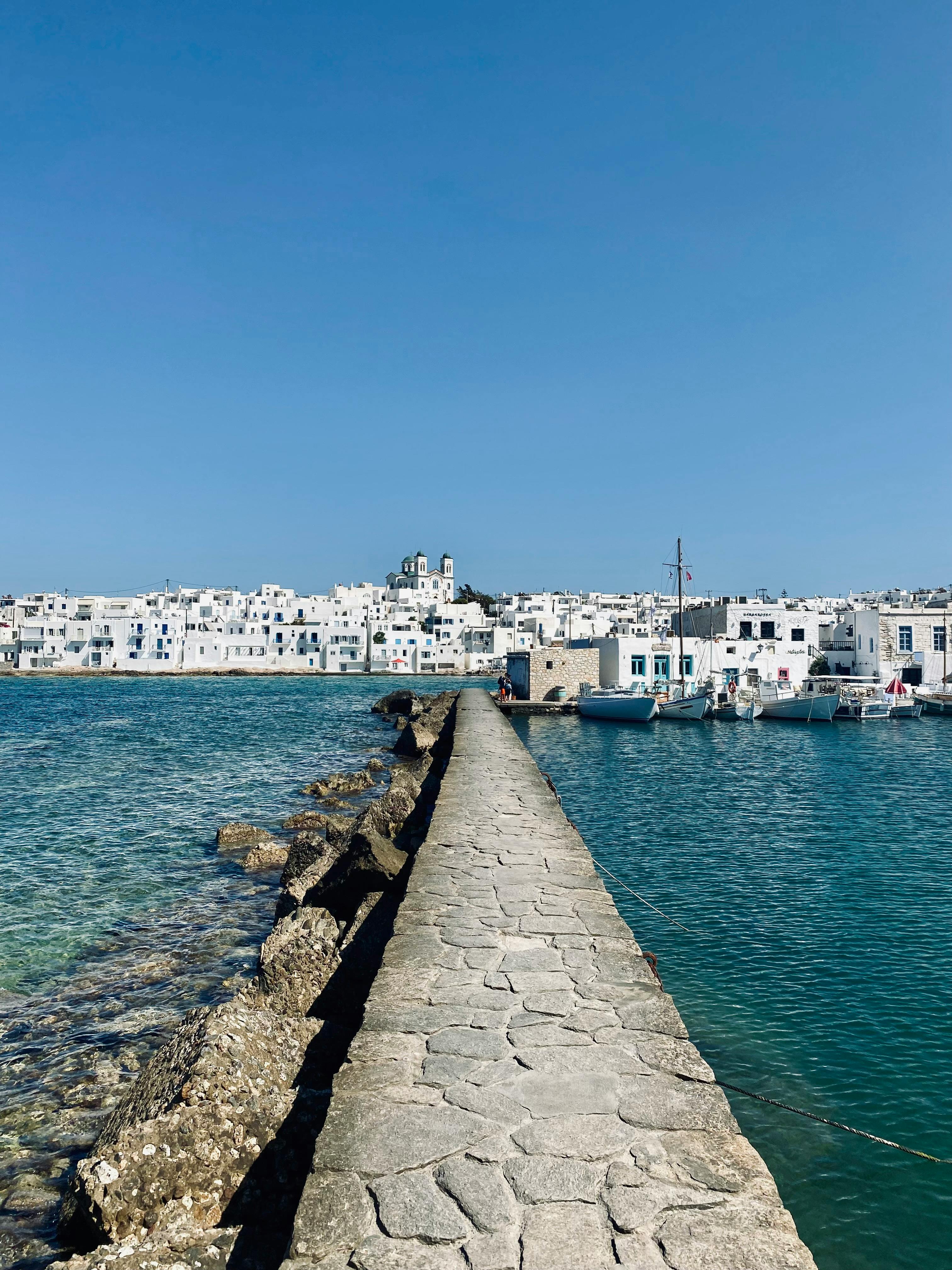 White Architecture of Seaside City with Stone Pier · Free Stock Photo