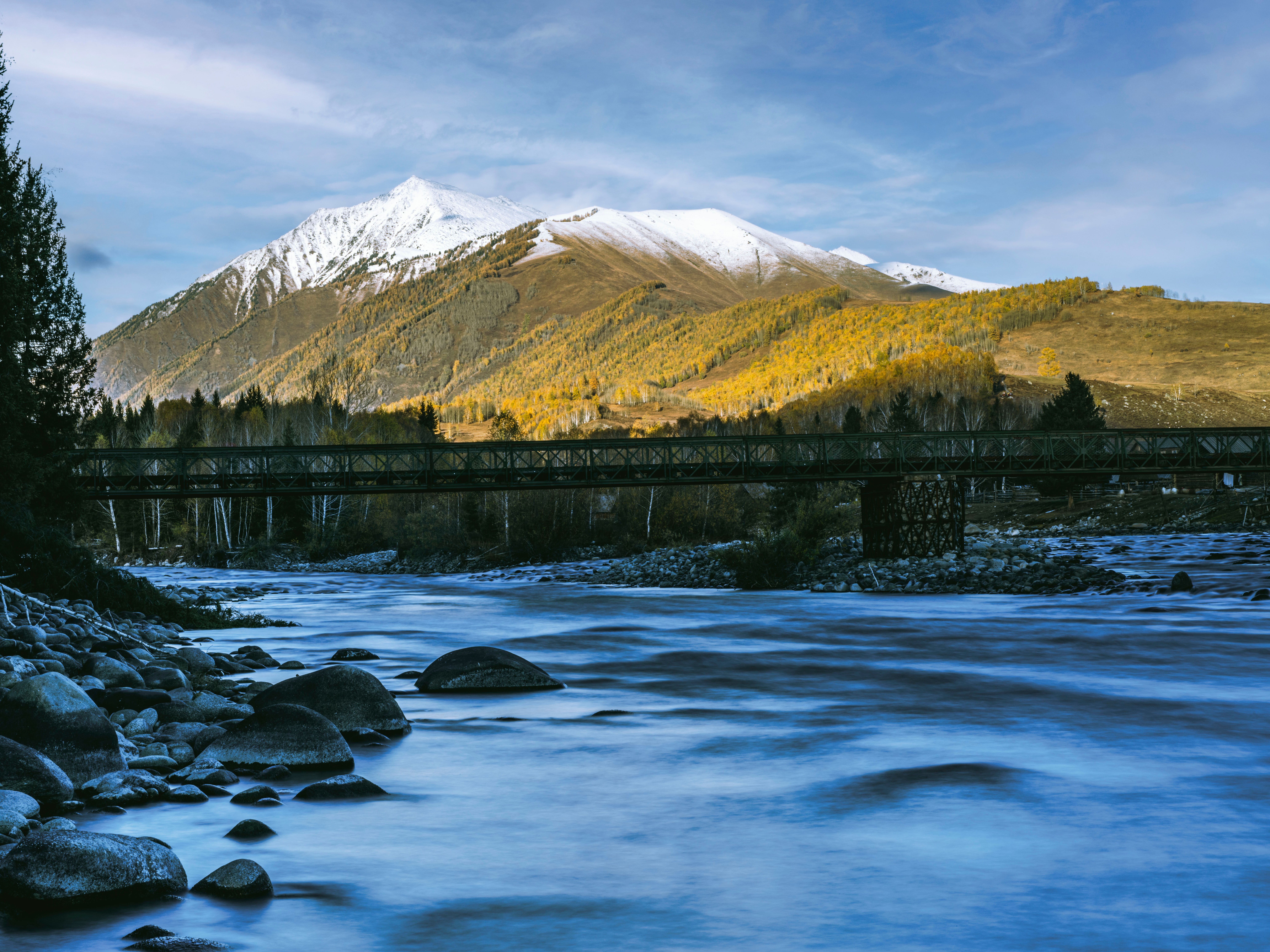 A Metal Bridge Over the Stream Near Green Mountains · Free Stock Photo