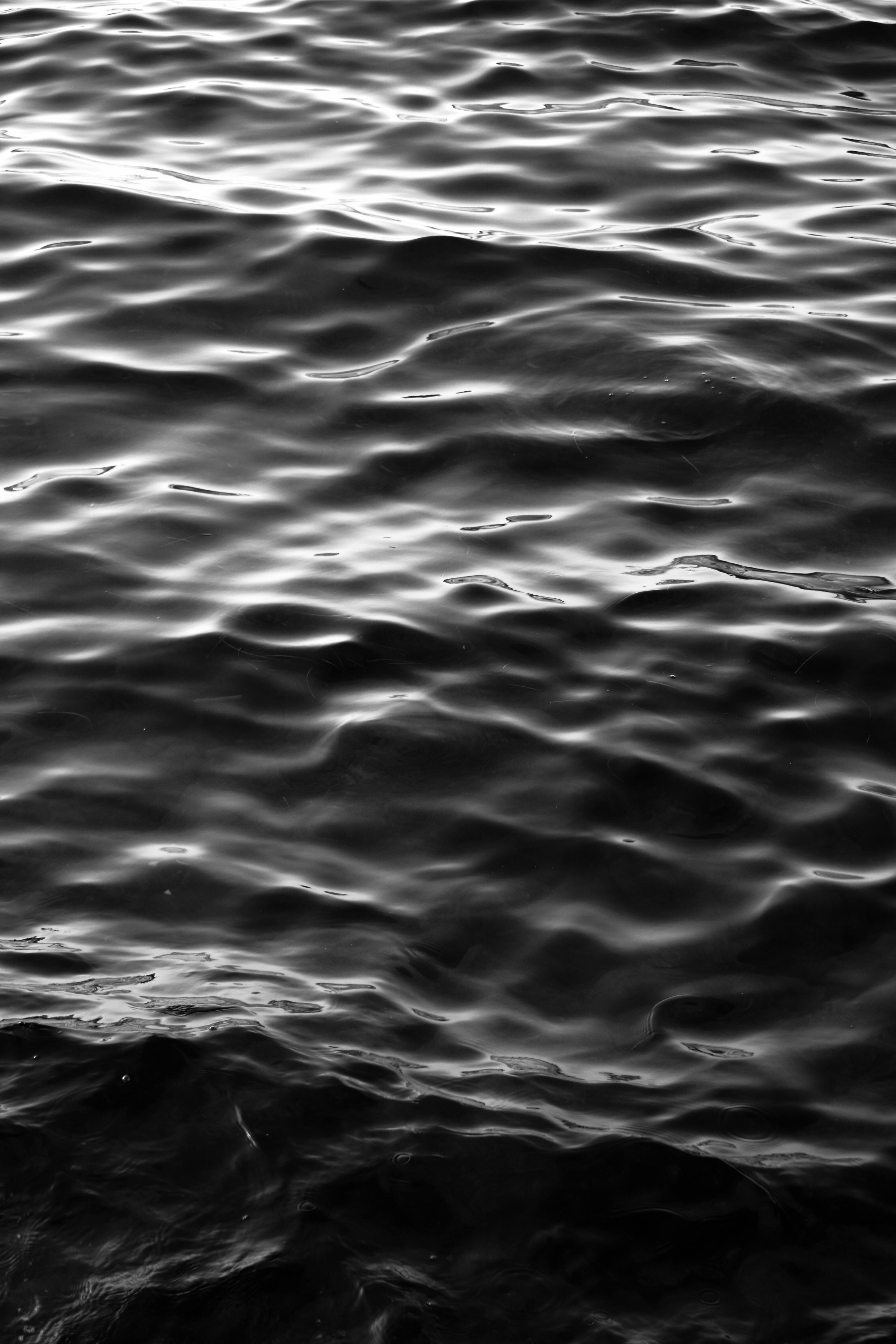 Grayscale Photo of Water Surface · Free Stock Photo