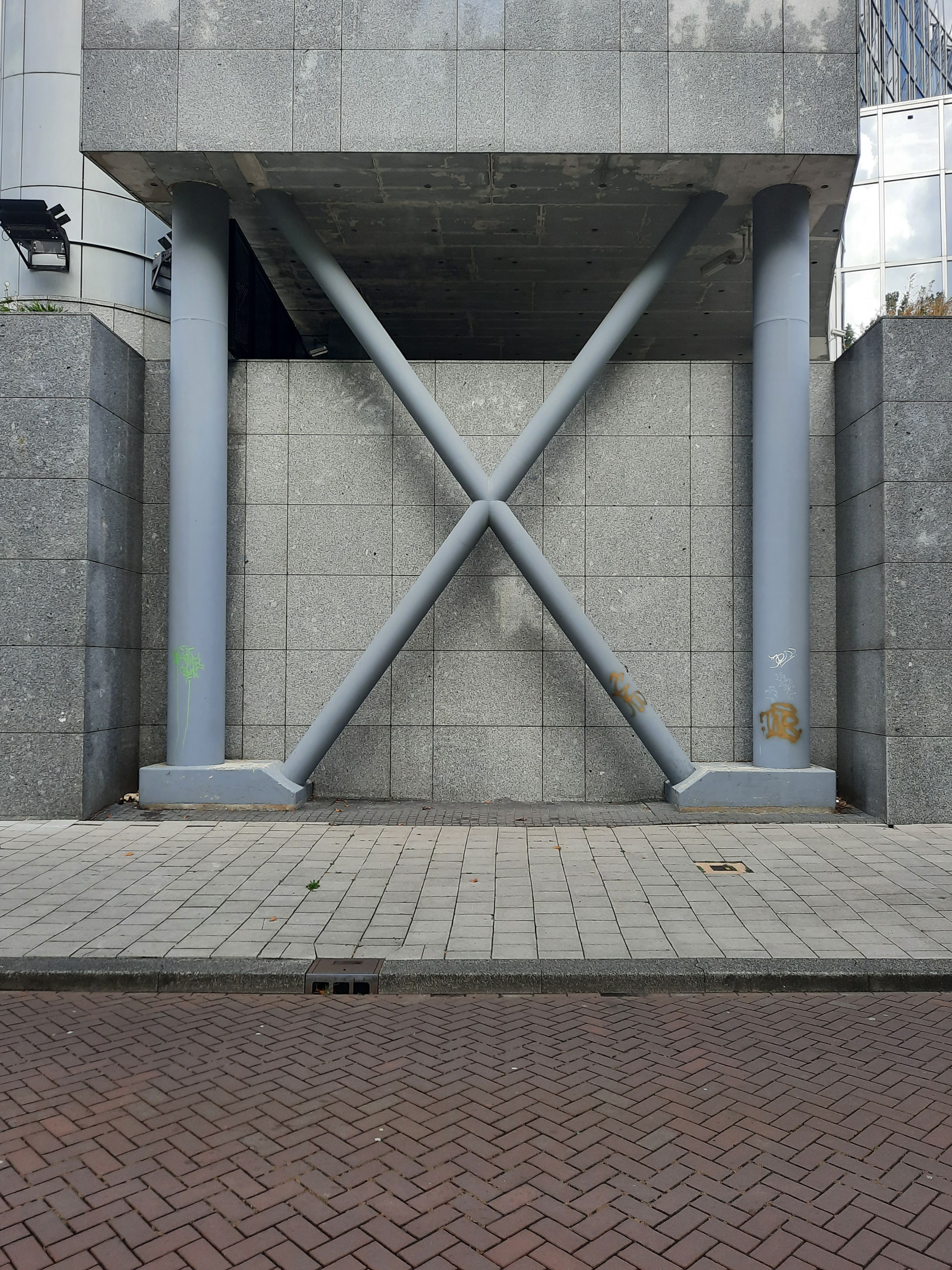 Metal Columns Under Concrete Wall · Free Stock Photo