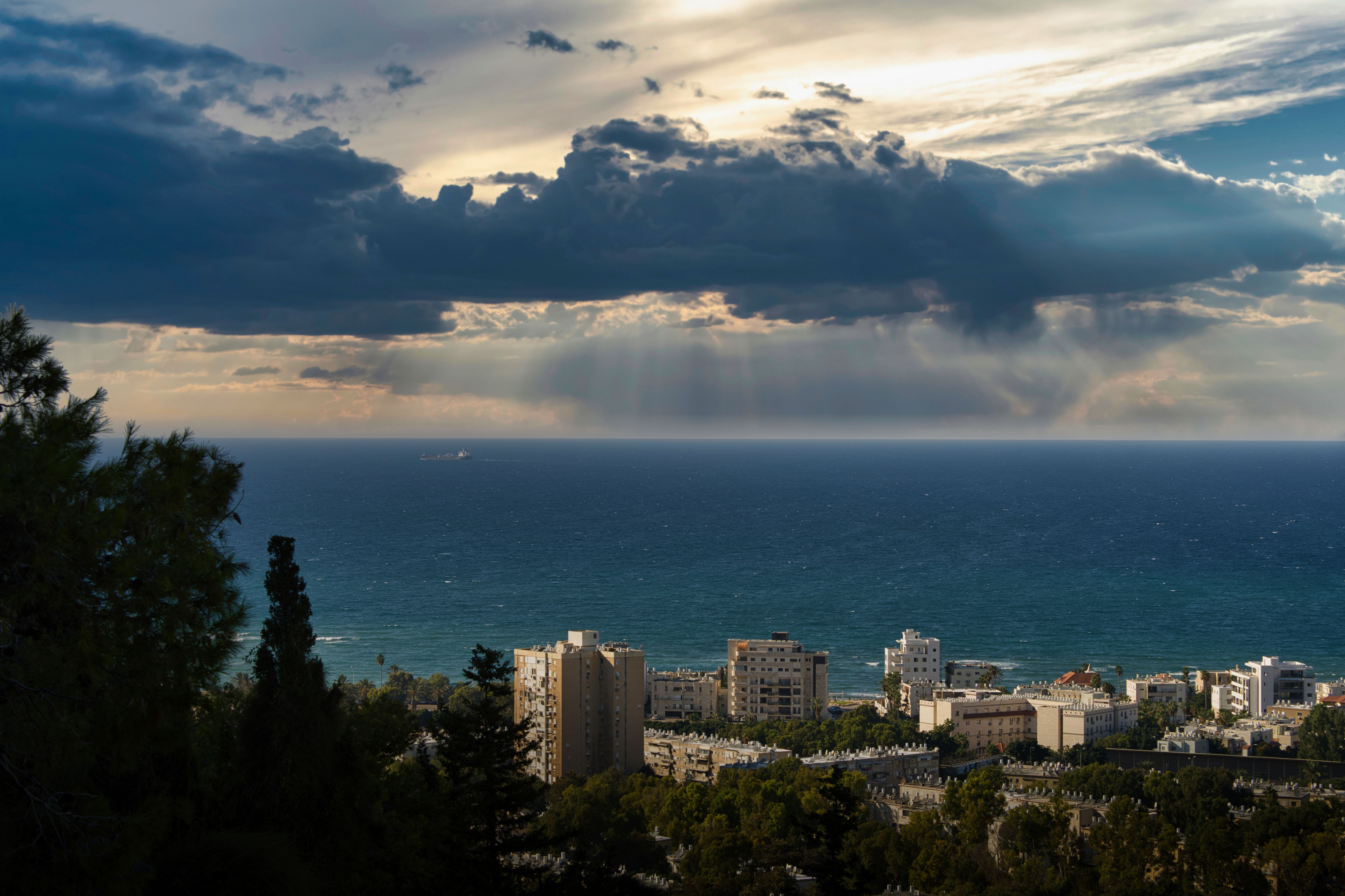 Aerial Photography of City Buildings near Ocean under the Cloudy Sky ...