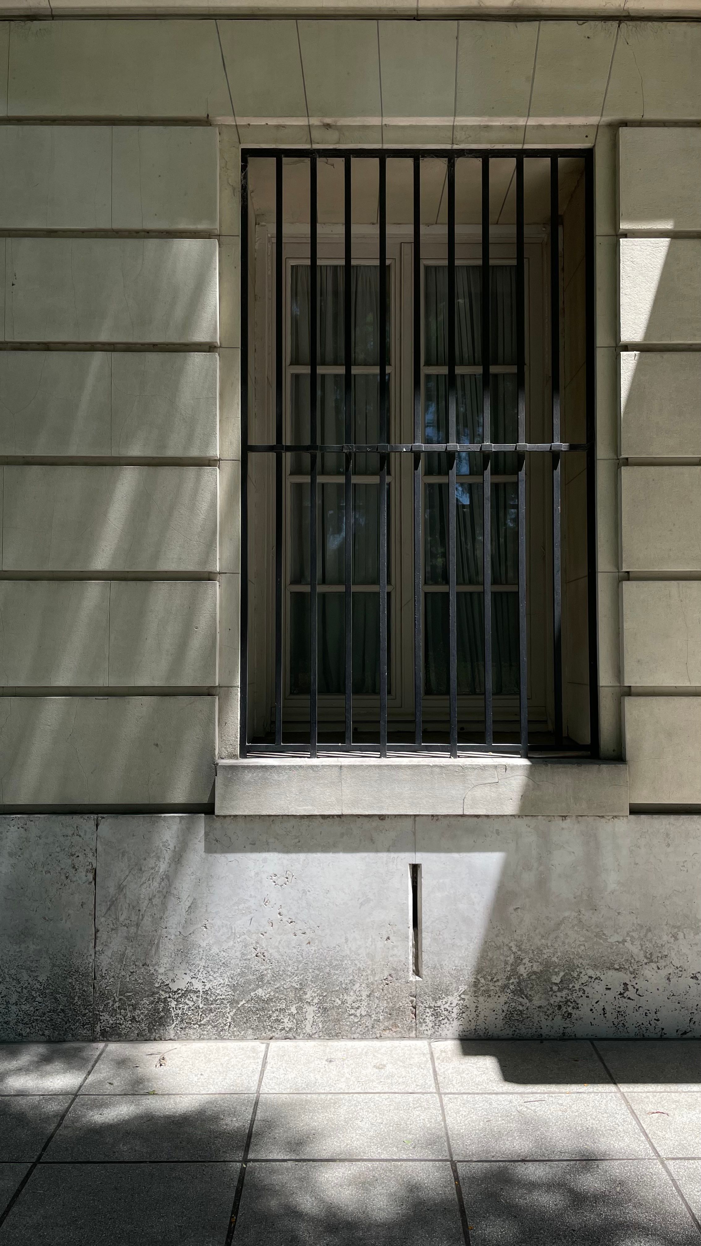 Black Metal Window Frame on White Concrete Wall · Free Stock Photo