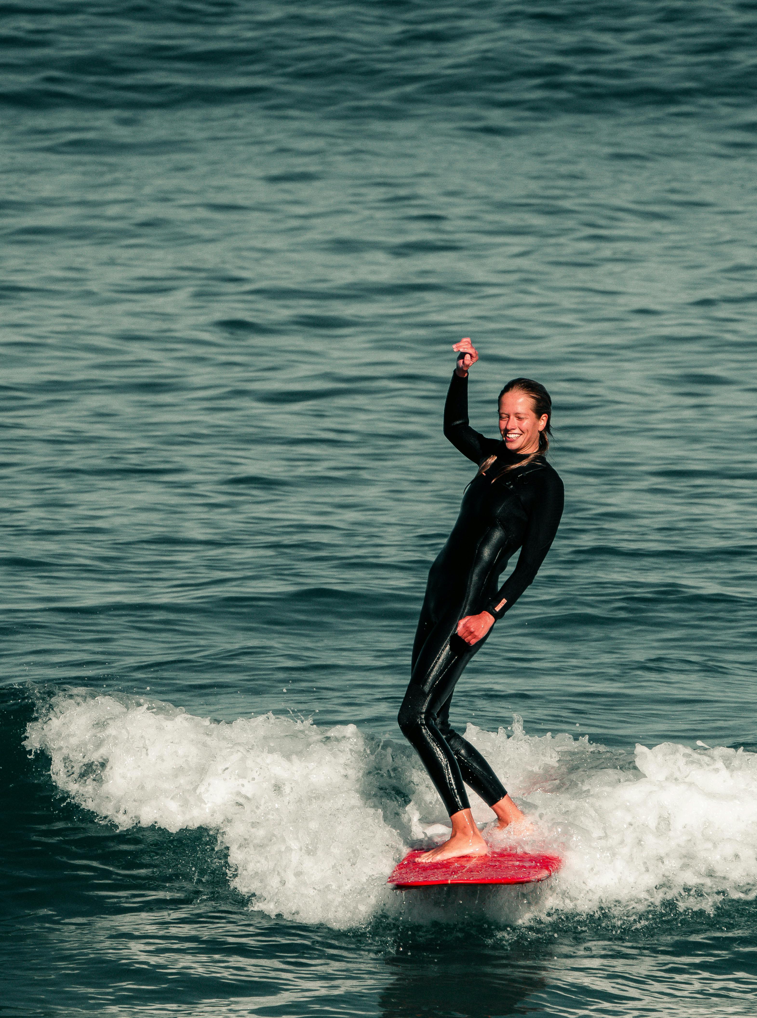 Photo of a Woman Surfing · Free Stock Photo