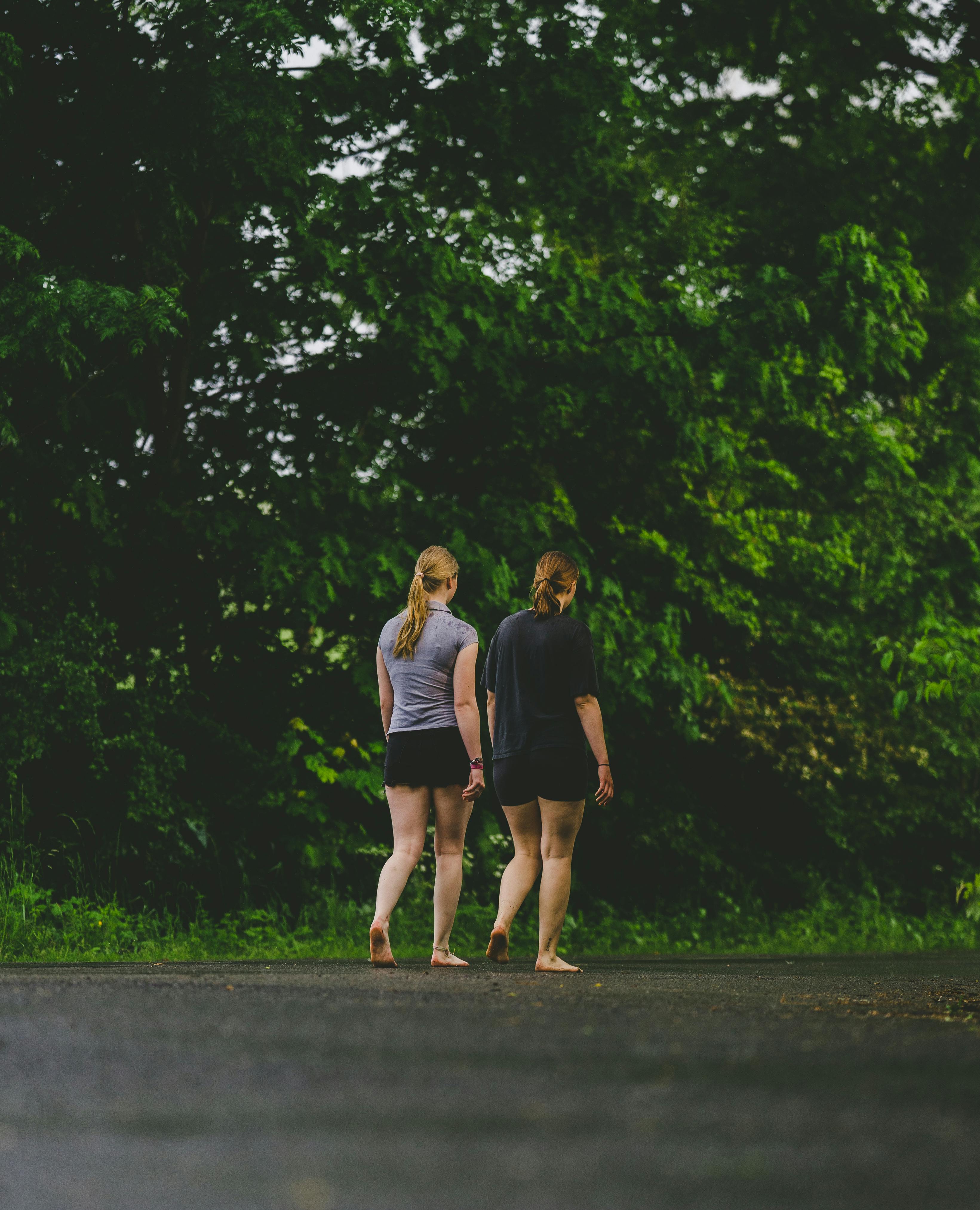Two Women Walking on Road · Free Stock Photo