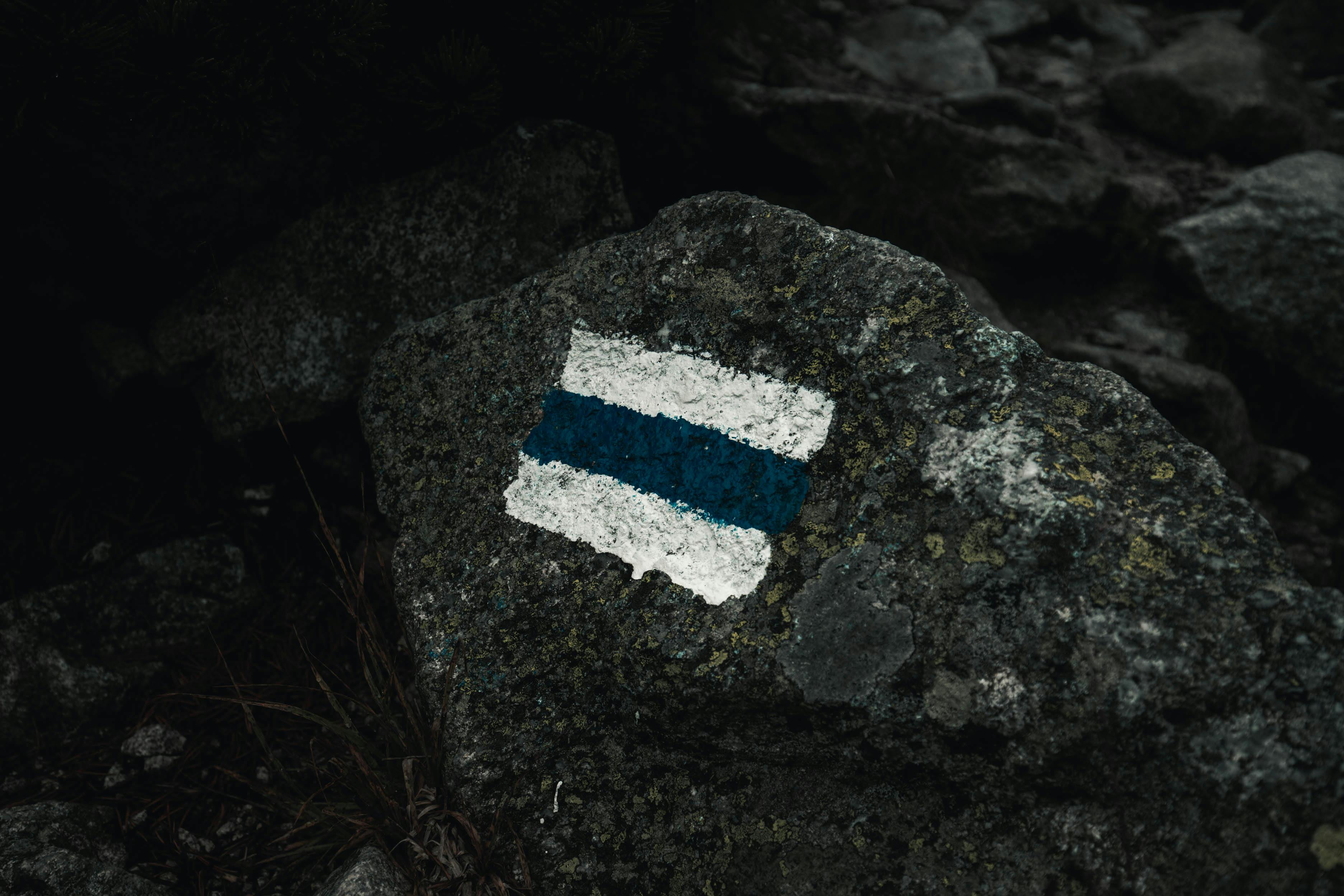 Tourist Trail Marking on a Stone · Free Stock Photo