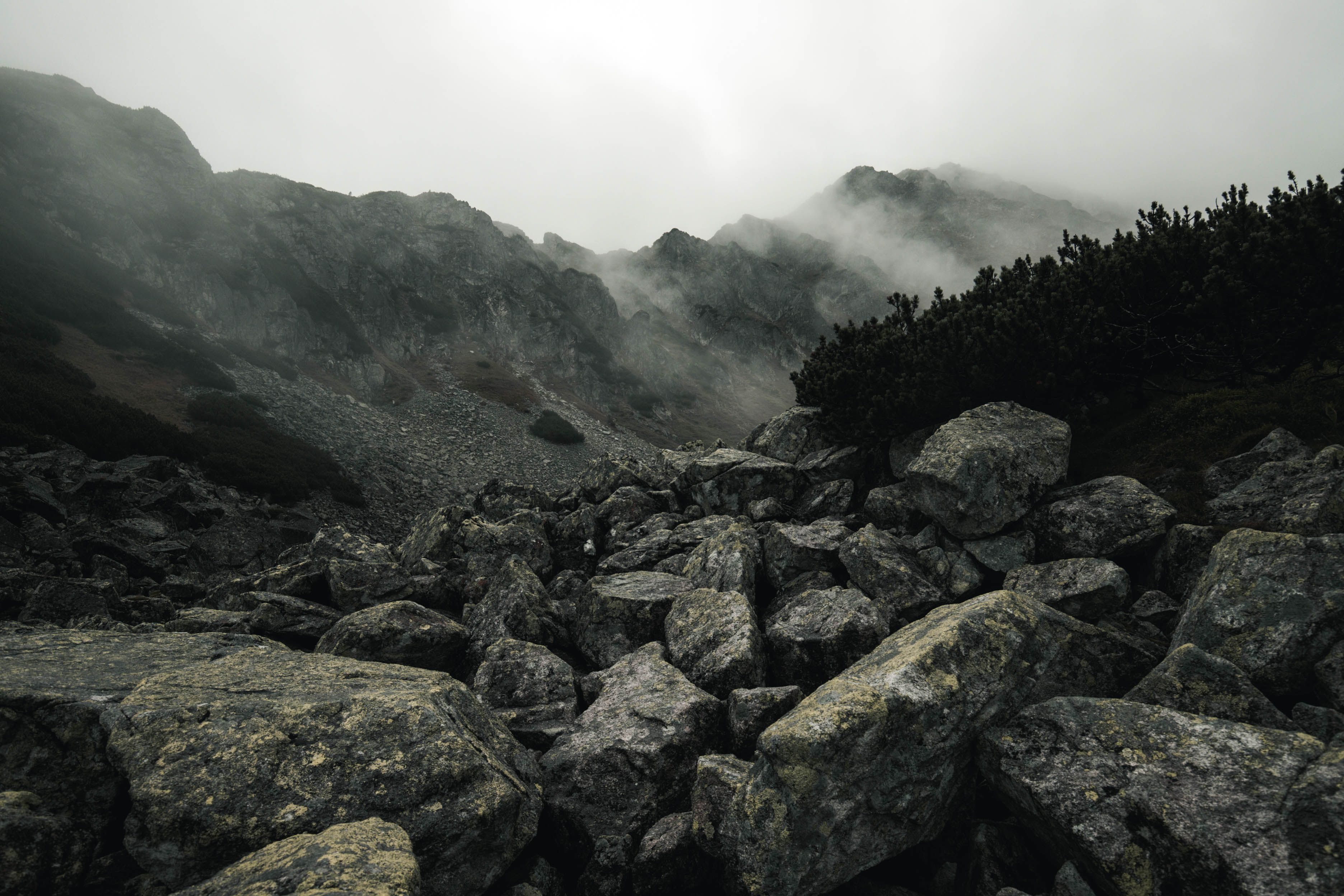 Gray Rocky Mountain Under White Sky · Free Stock Photo