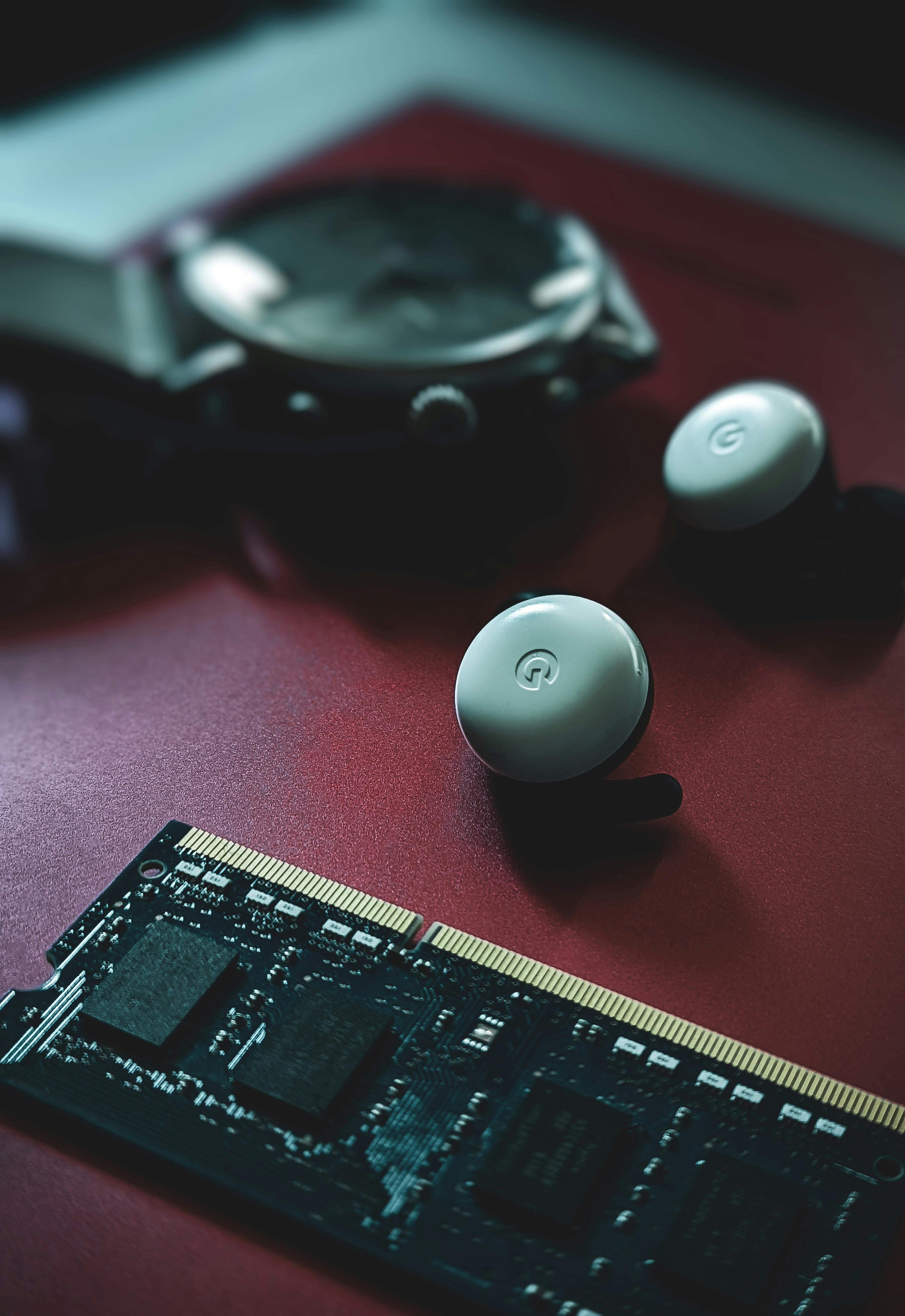 White and Green Computer Parts Beside Laptop · Free Stock Photo