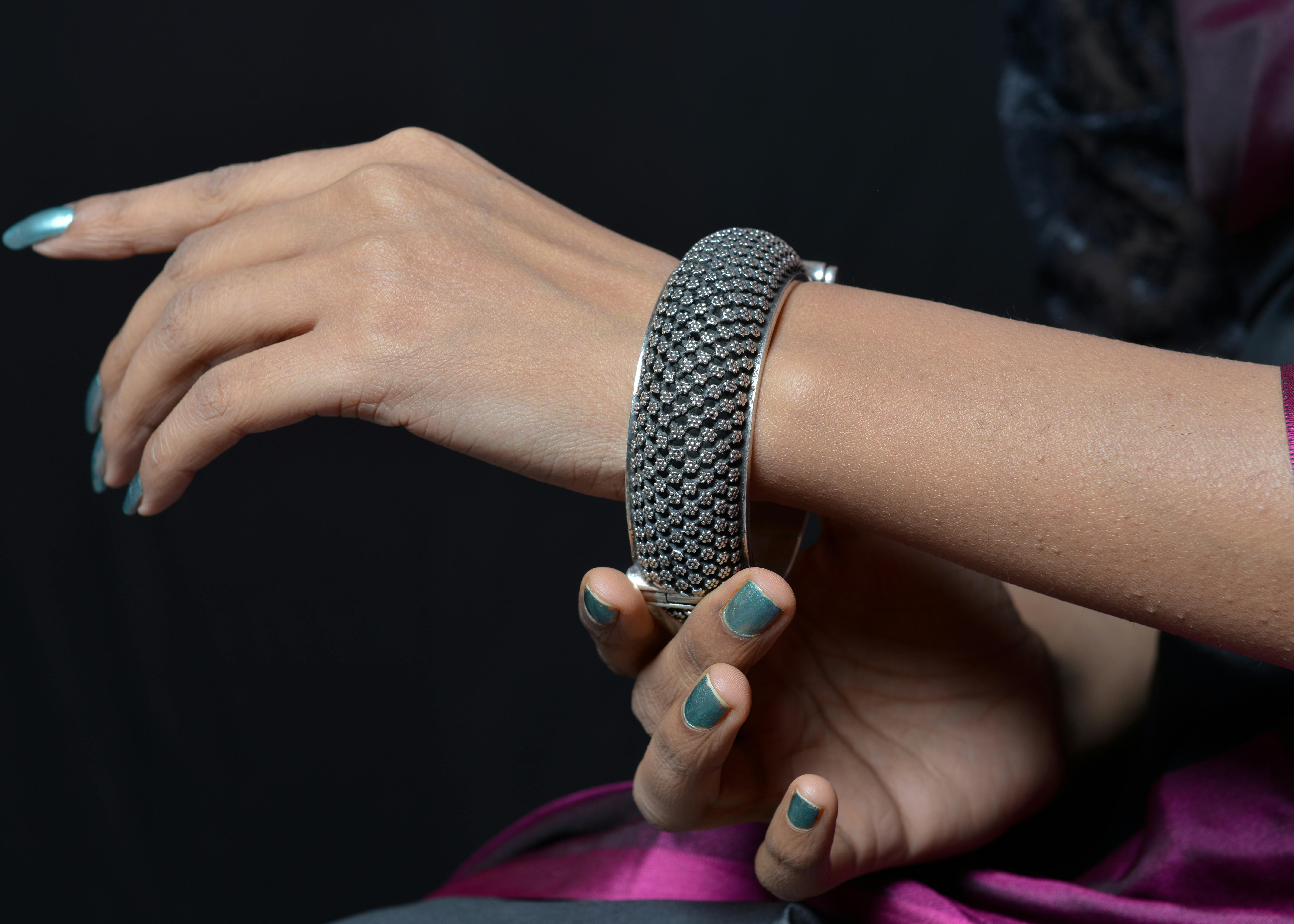 Hands Holding Bracelets · Free Stock Photo