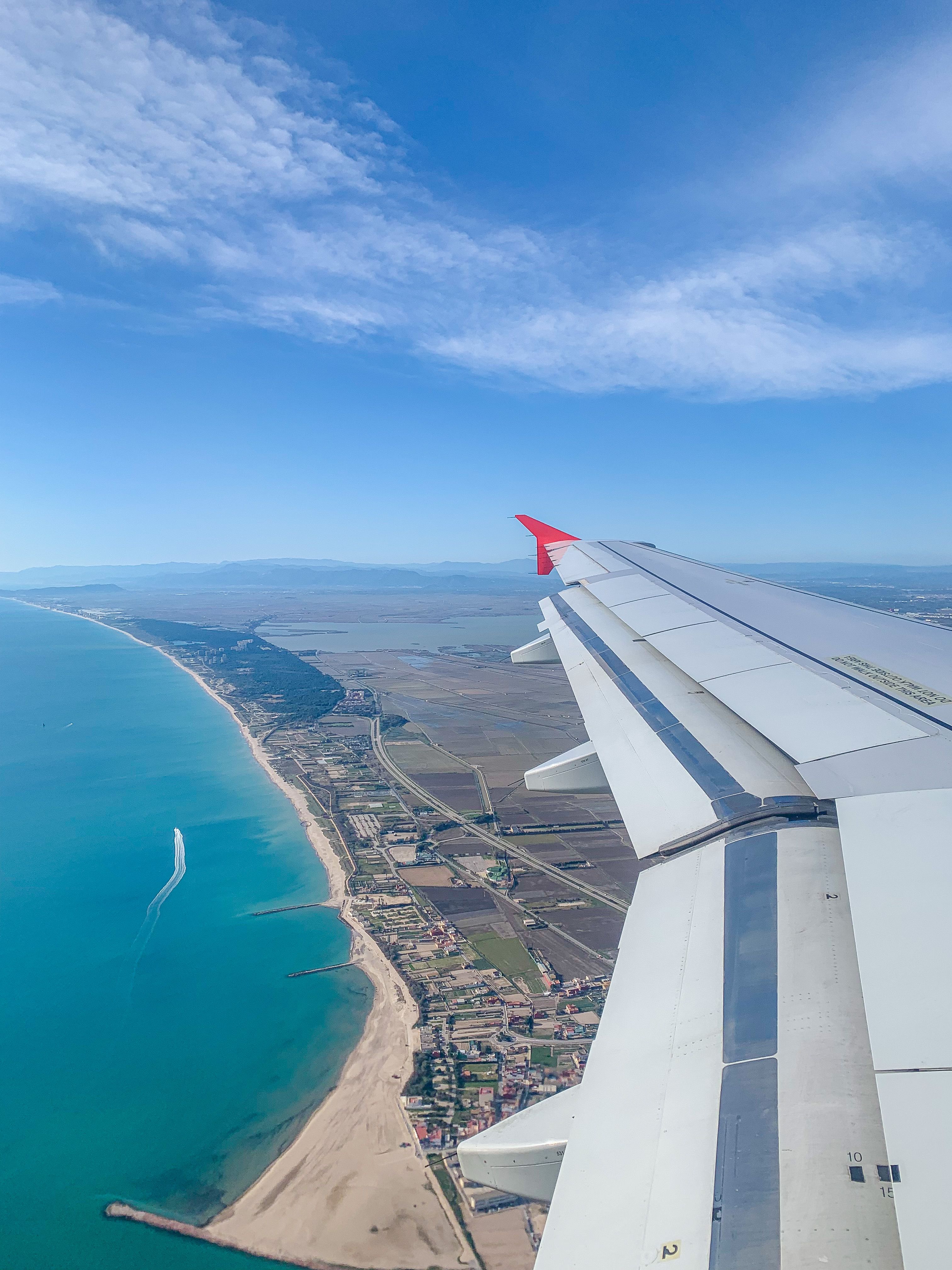 Green and Black Propeller Plane Flying Under Clear Sky · Free Stock Photo