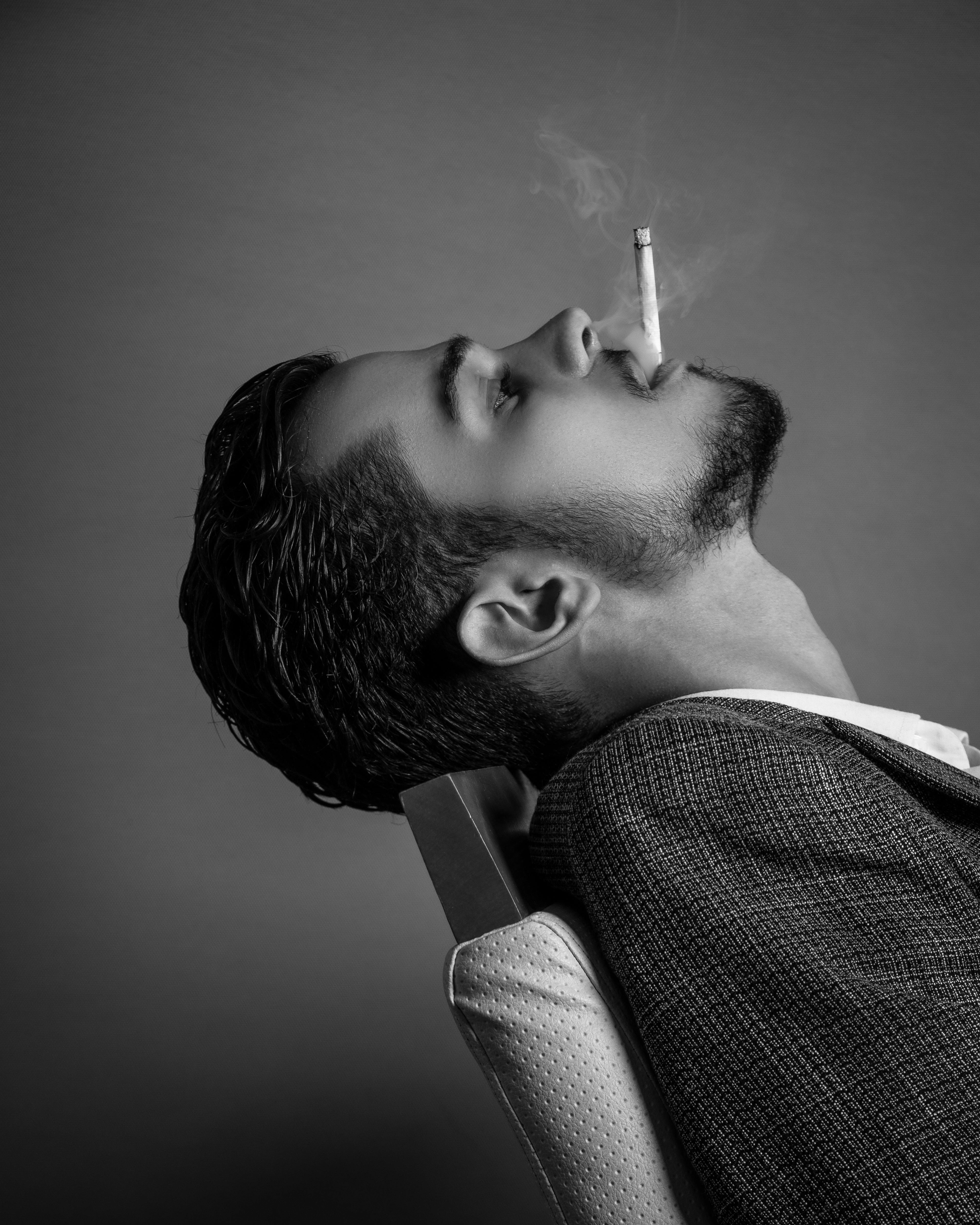 Grayscale Photo of a Man Smoking · Free Stock Photo