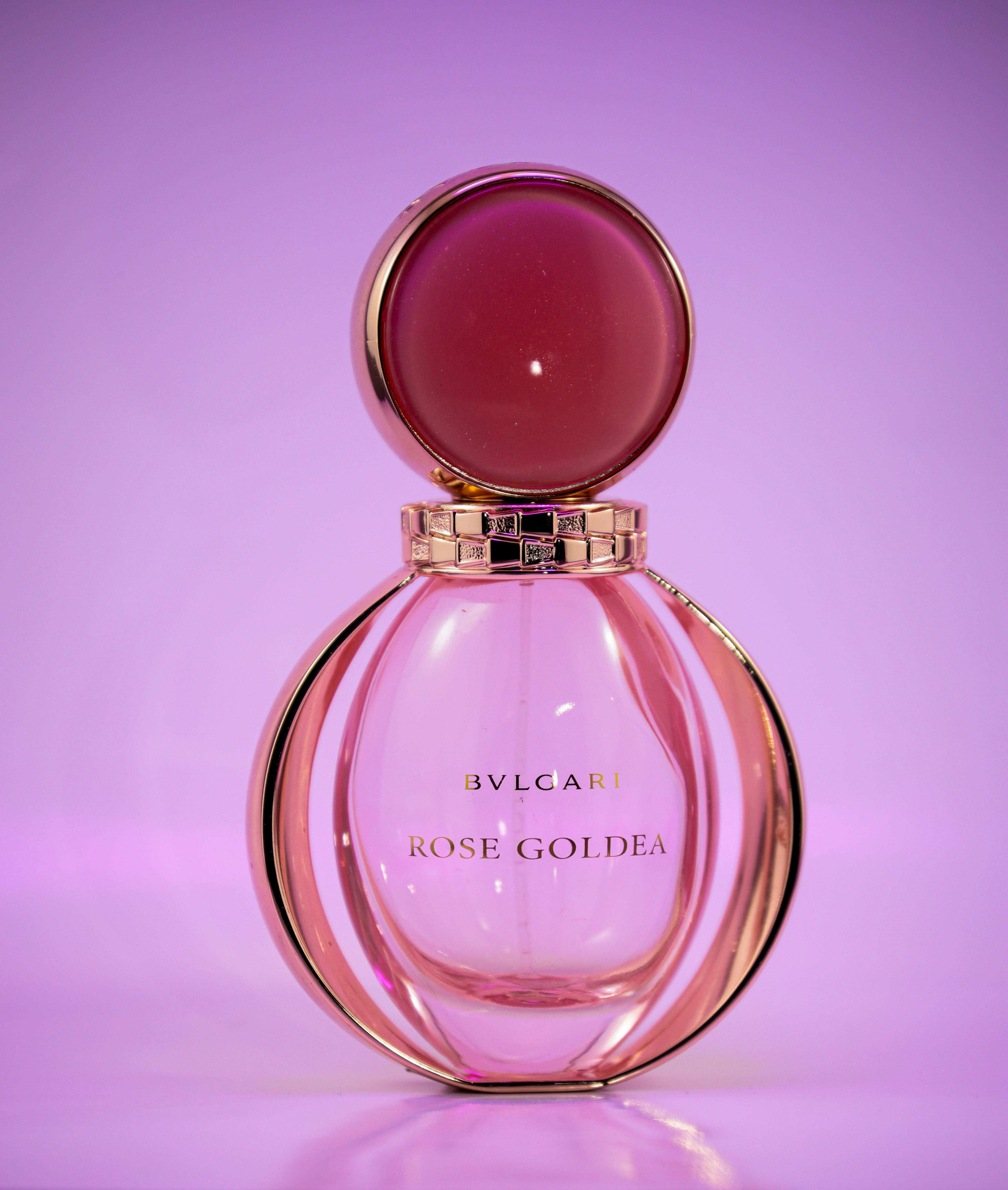 Luxurious Perfume Bottle on a Golden Silk Textile · Free Stock Photo