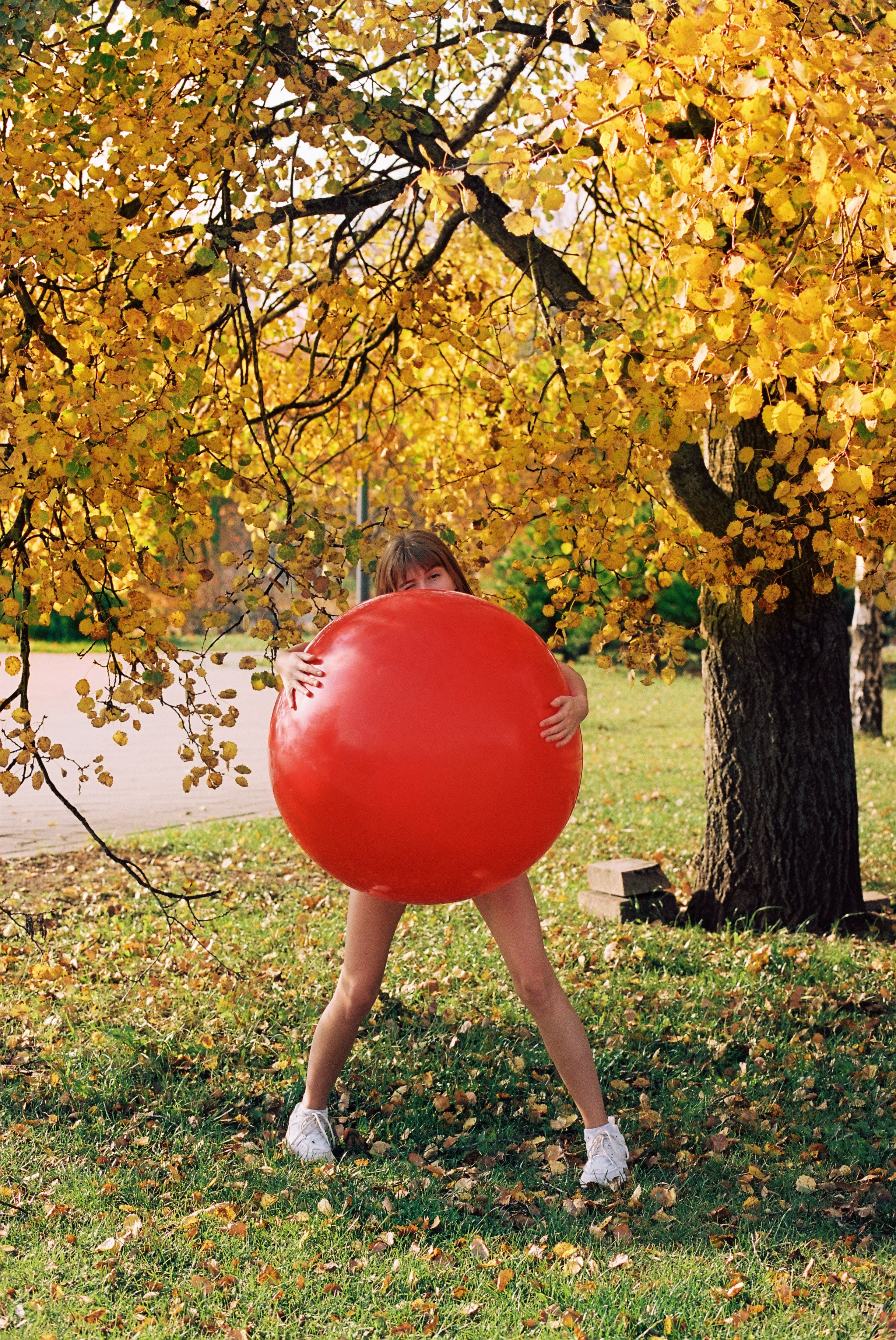 A Woman Carrying an Exercise Ball · Free Stock Photo