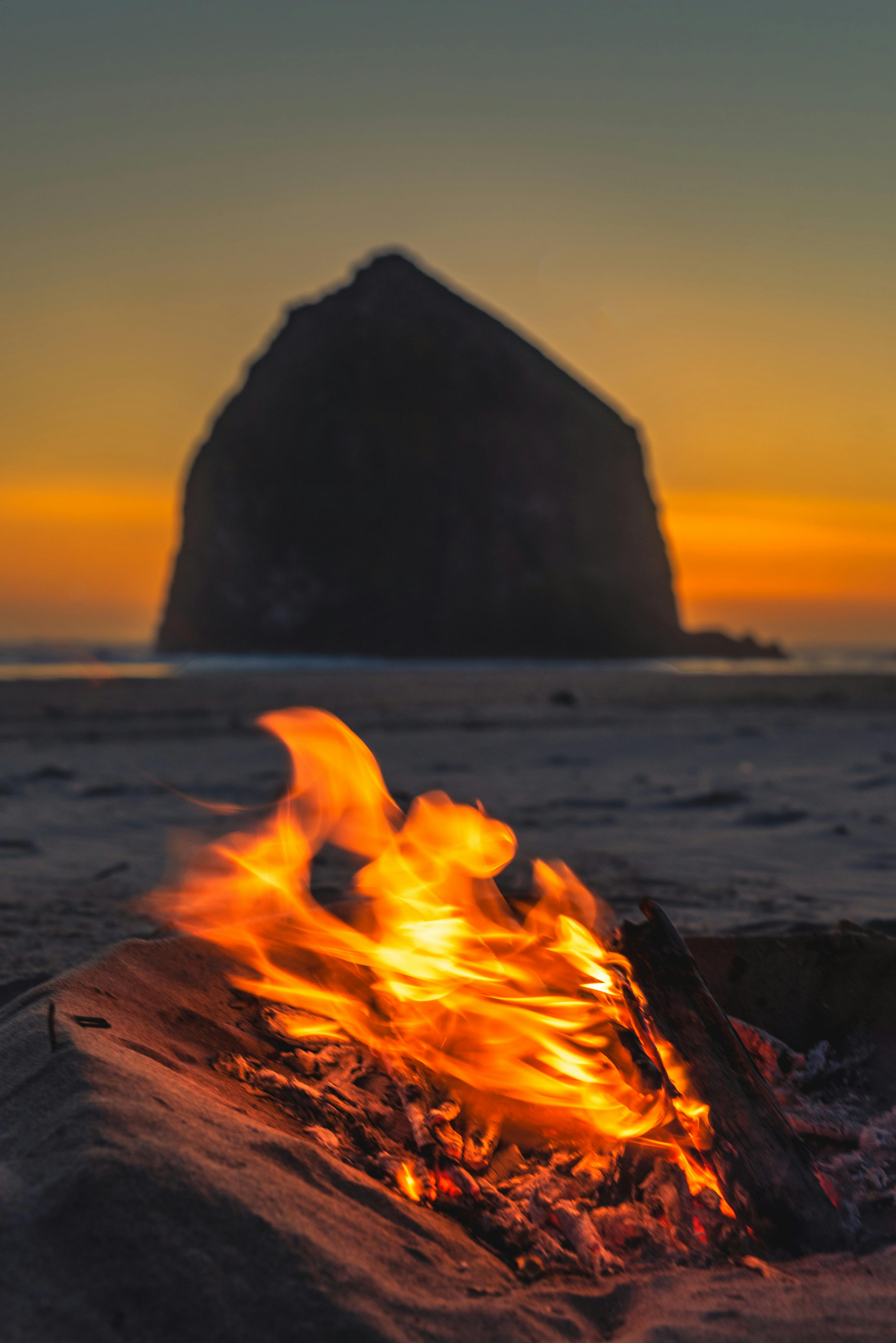 Fire Burning on the Beach at Dusk · Free Stock Photo