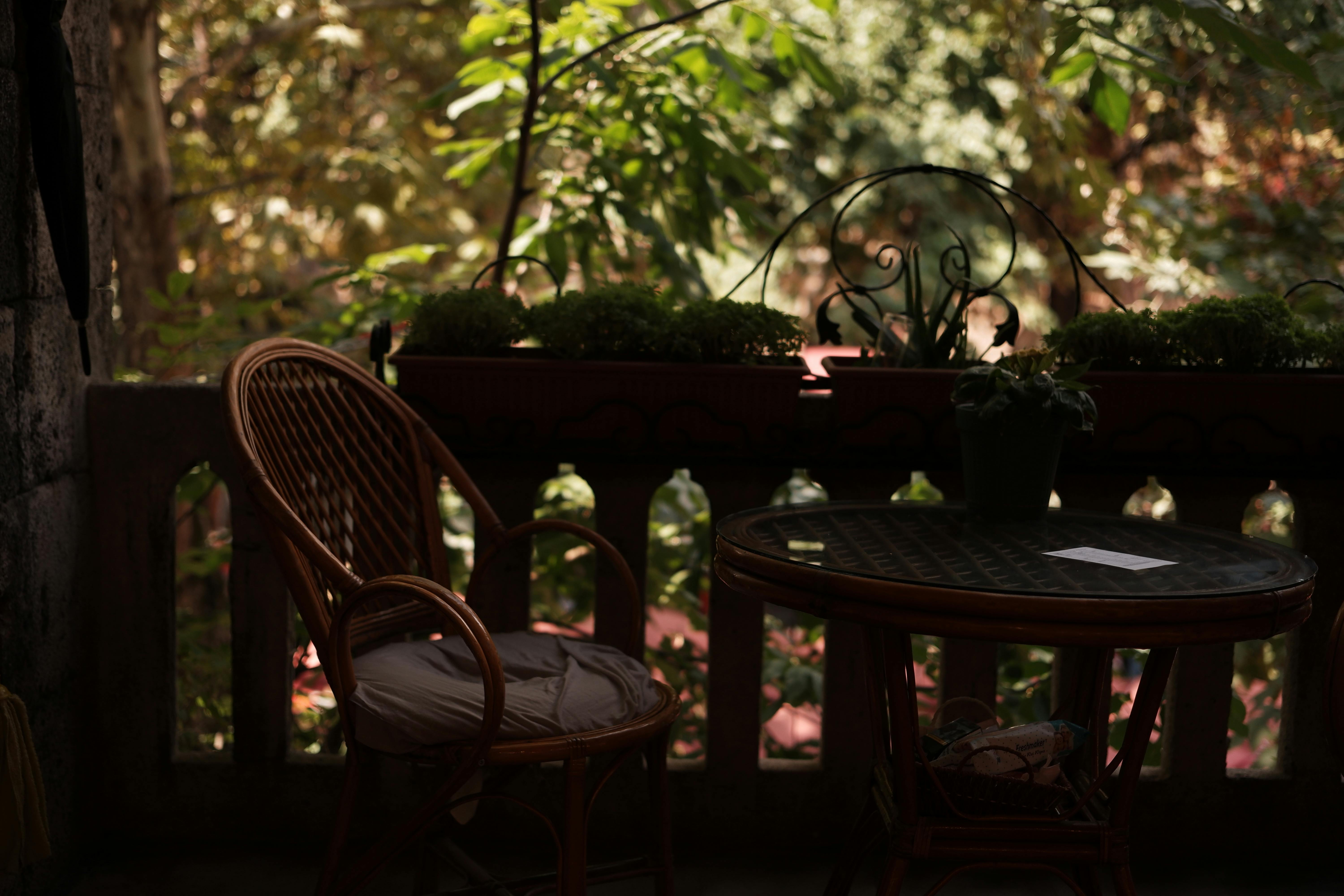Chair and Table on a Ground Terrace · Free Stock Photo