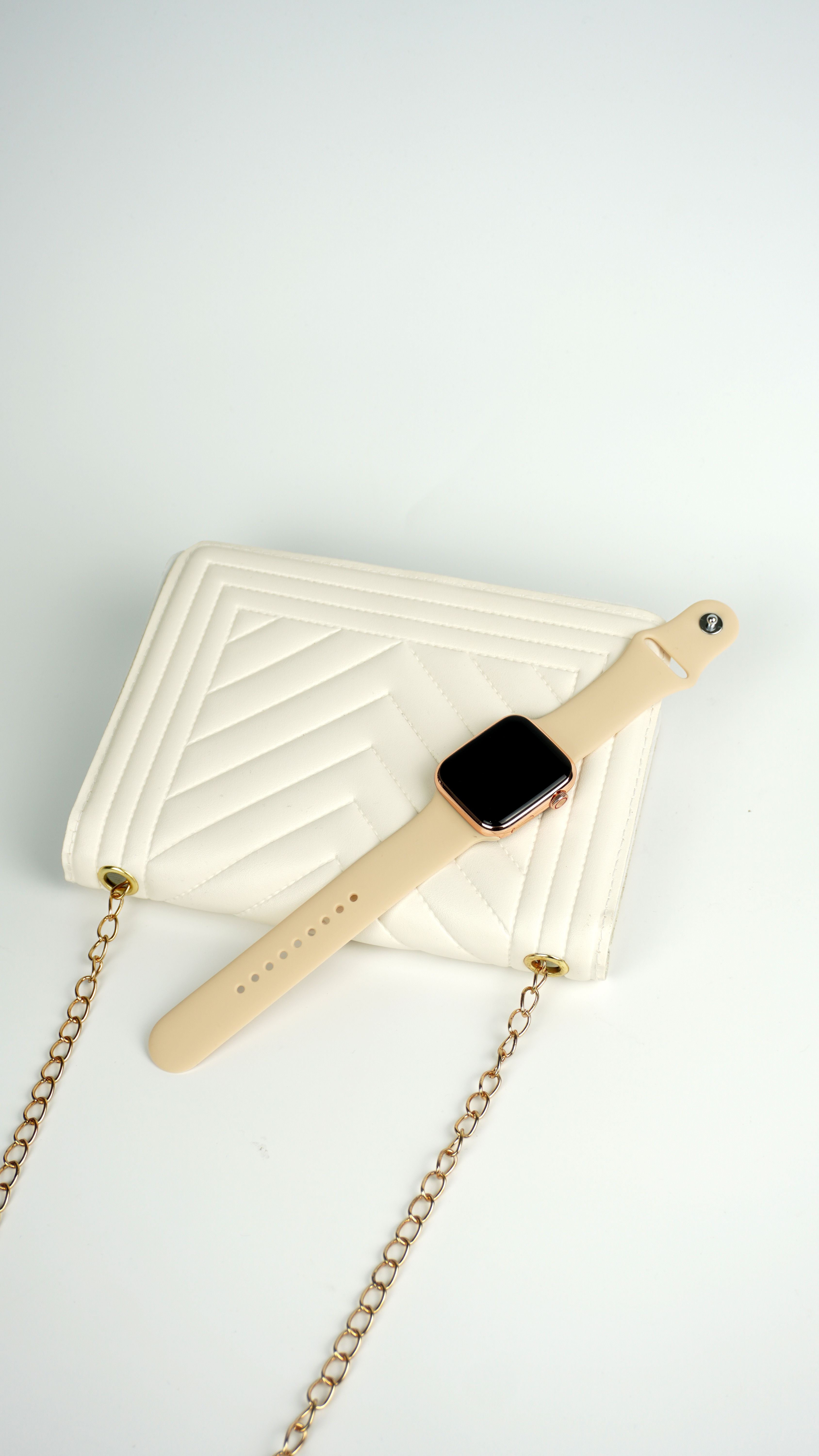 Smartwatch on Top of a White Handbag · Free Stock Photo
