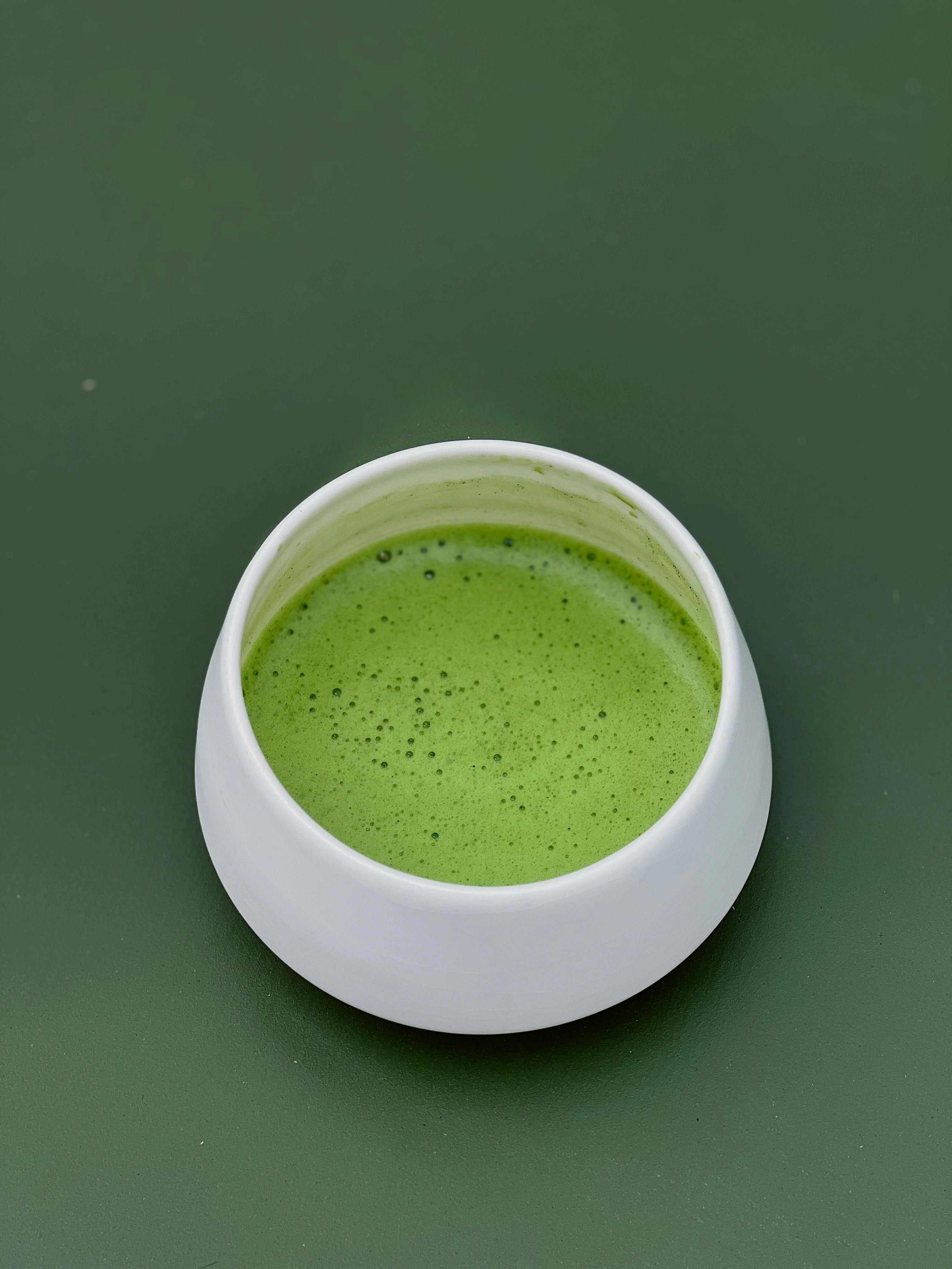 Moringa Tea on White Surface · Free Stock Photo