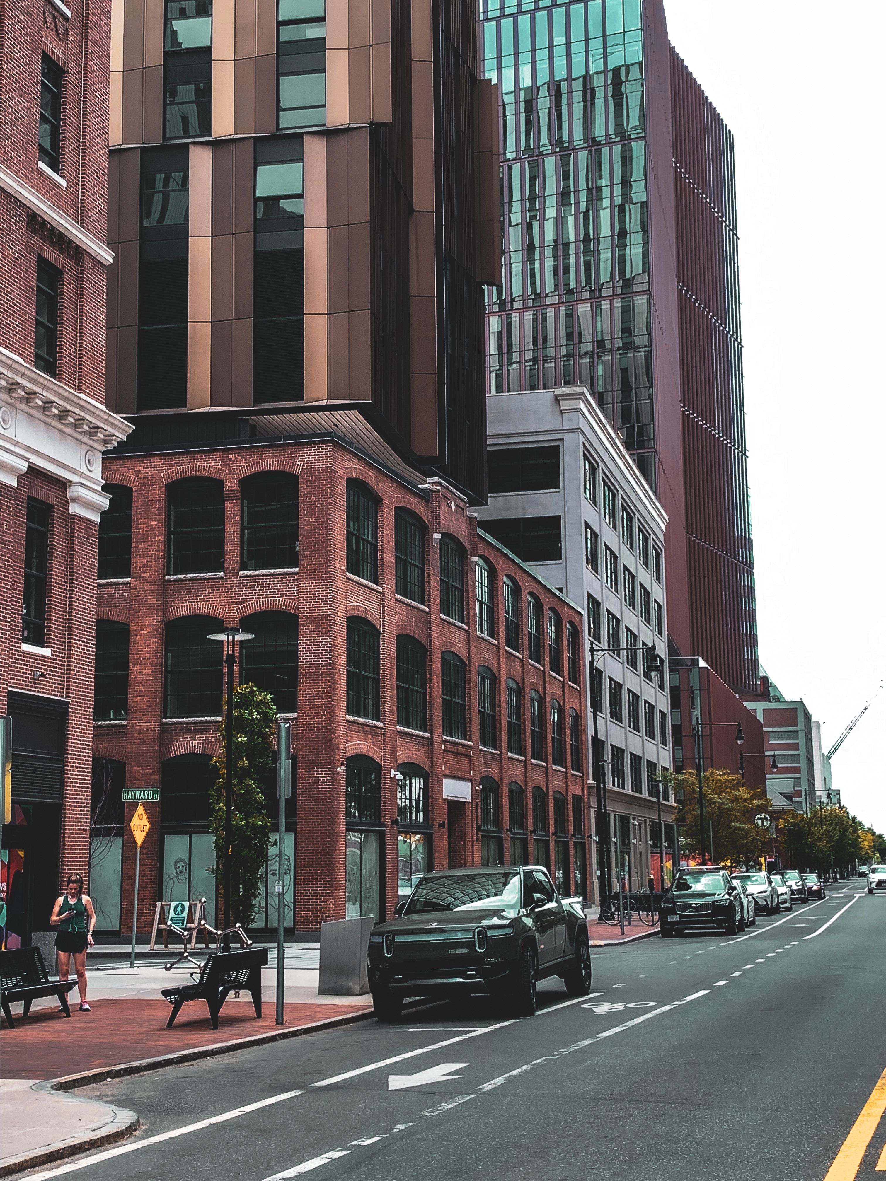 Cars on Road Near Buildings · Free Stock Photo