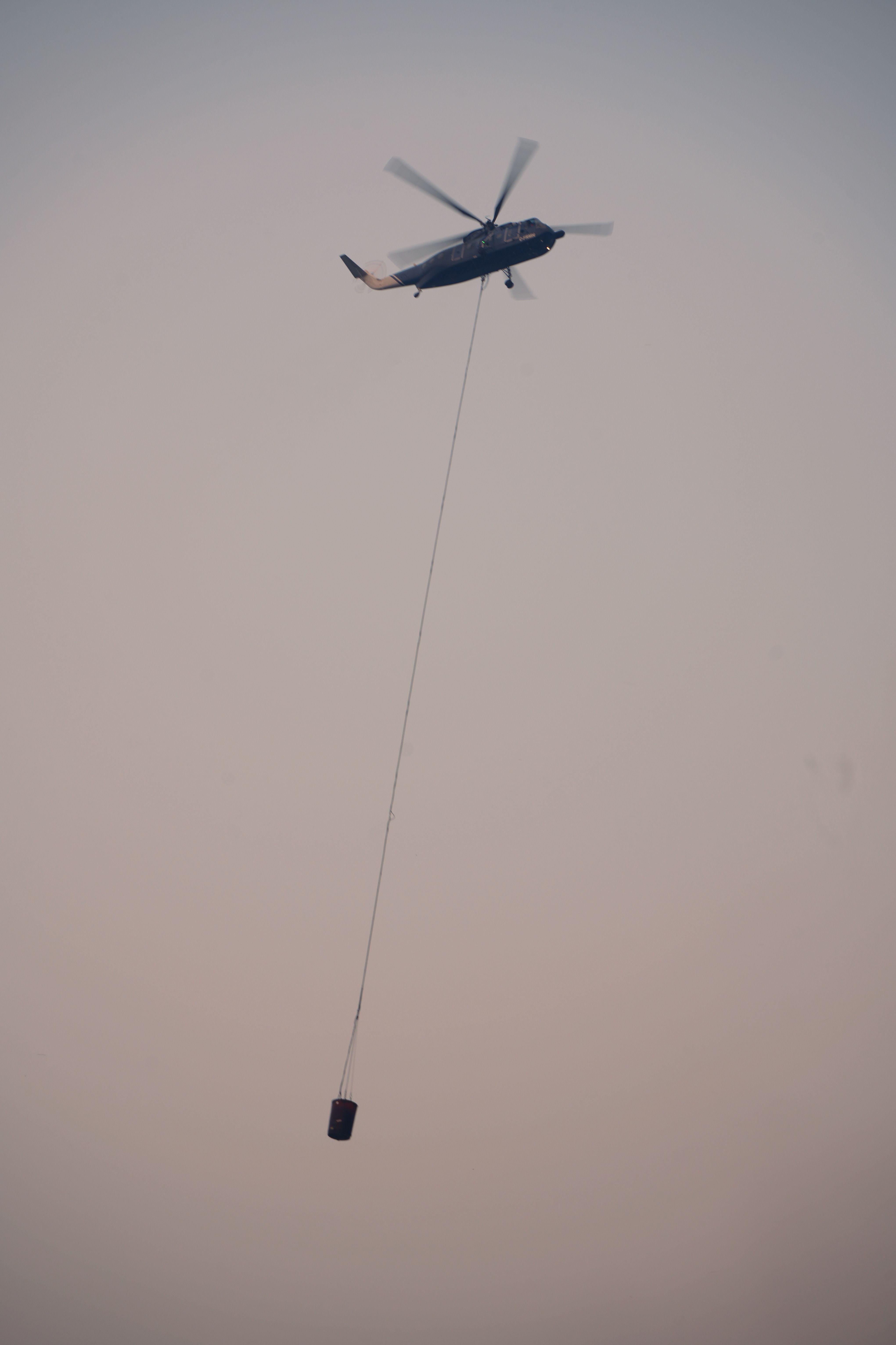 Low-Angle Photo of Helicopter Flying Above Building · Free Stock Photo