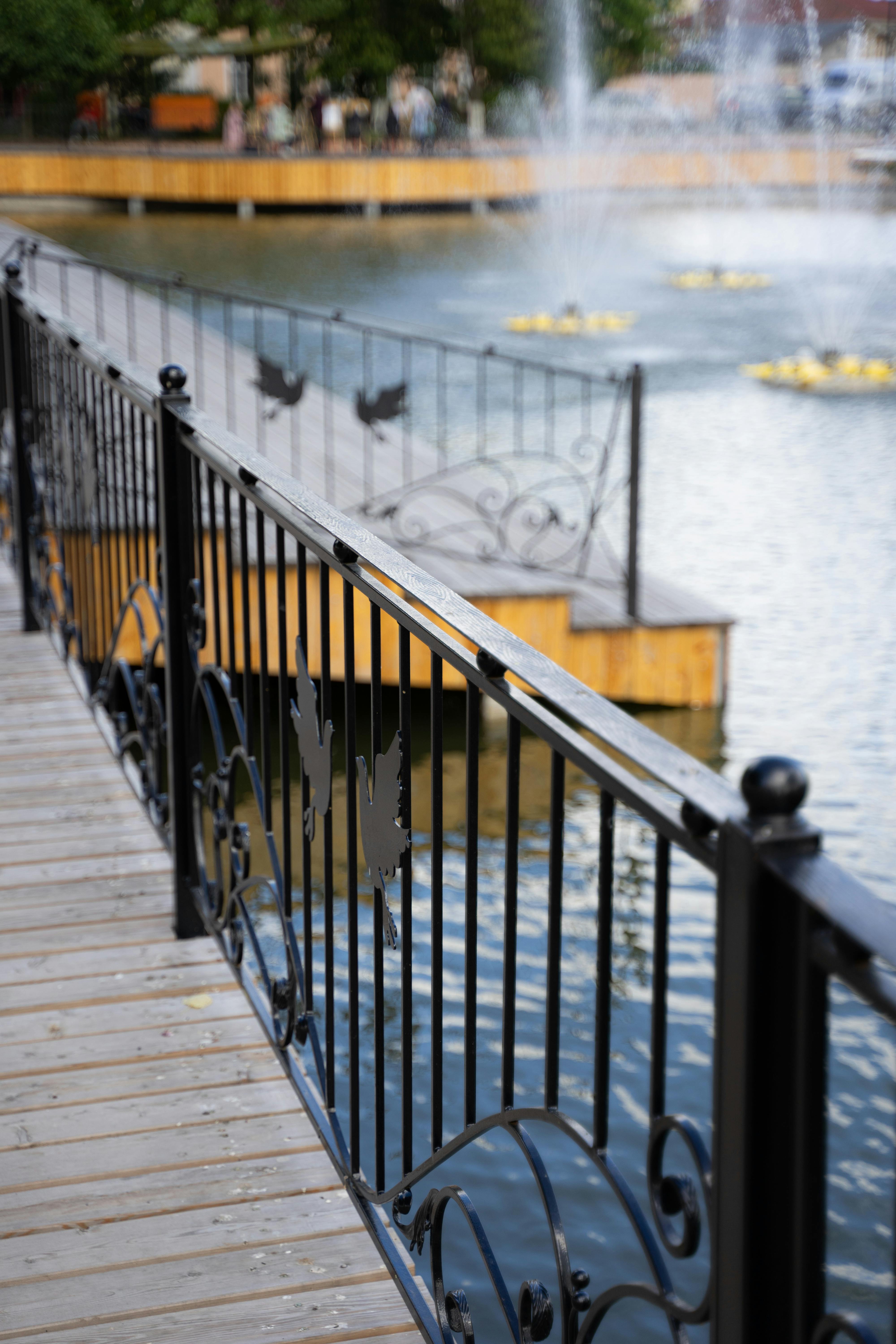 Decorative Railing along Wooden Promenade · Free Stock Photo