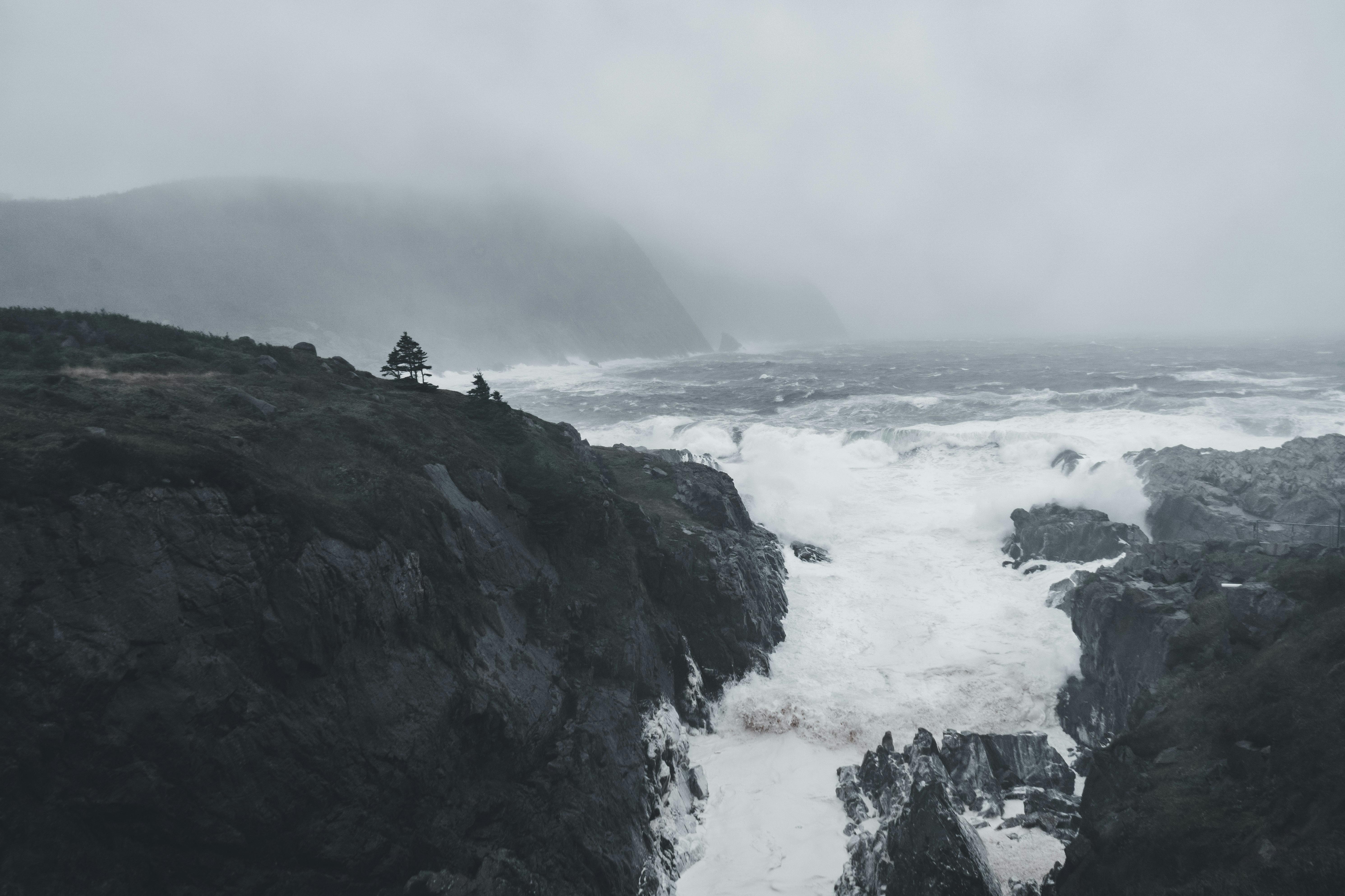 Man Standing at a Waterfall · Free Stock Photo