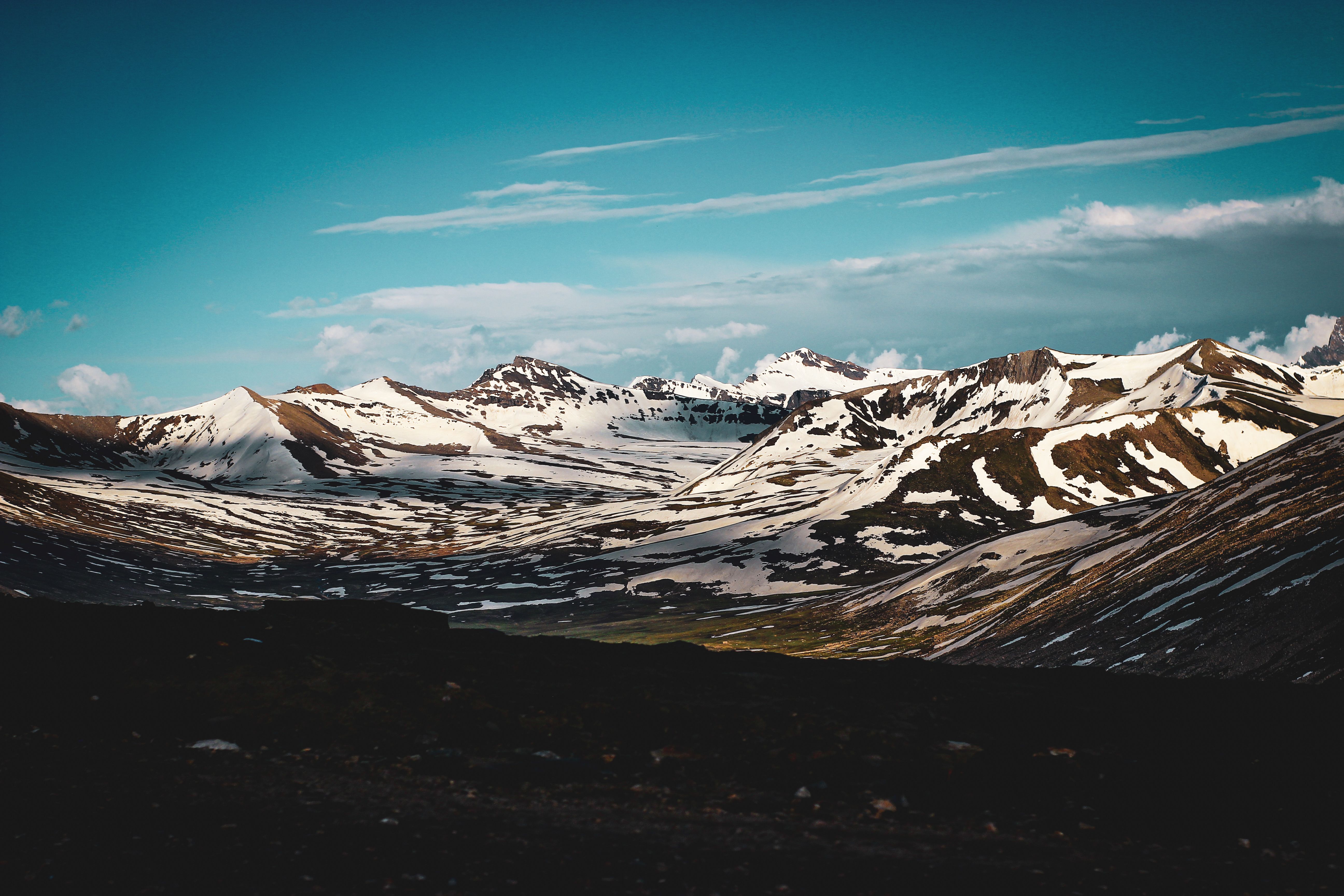 Body of Water Near Mountain Under Blue Sky · Free Stock Photo