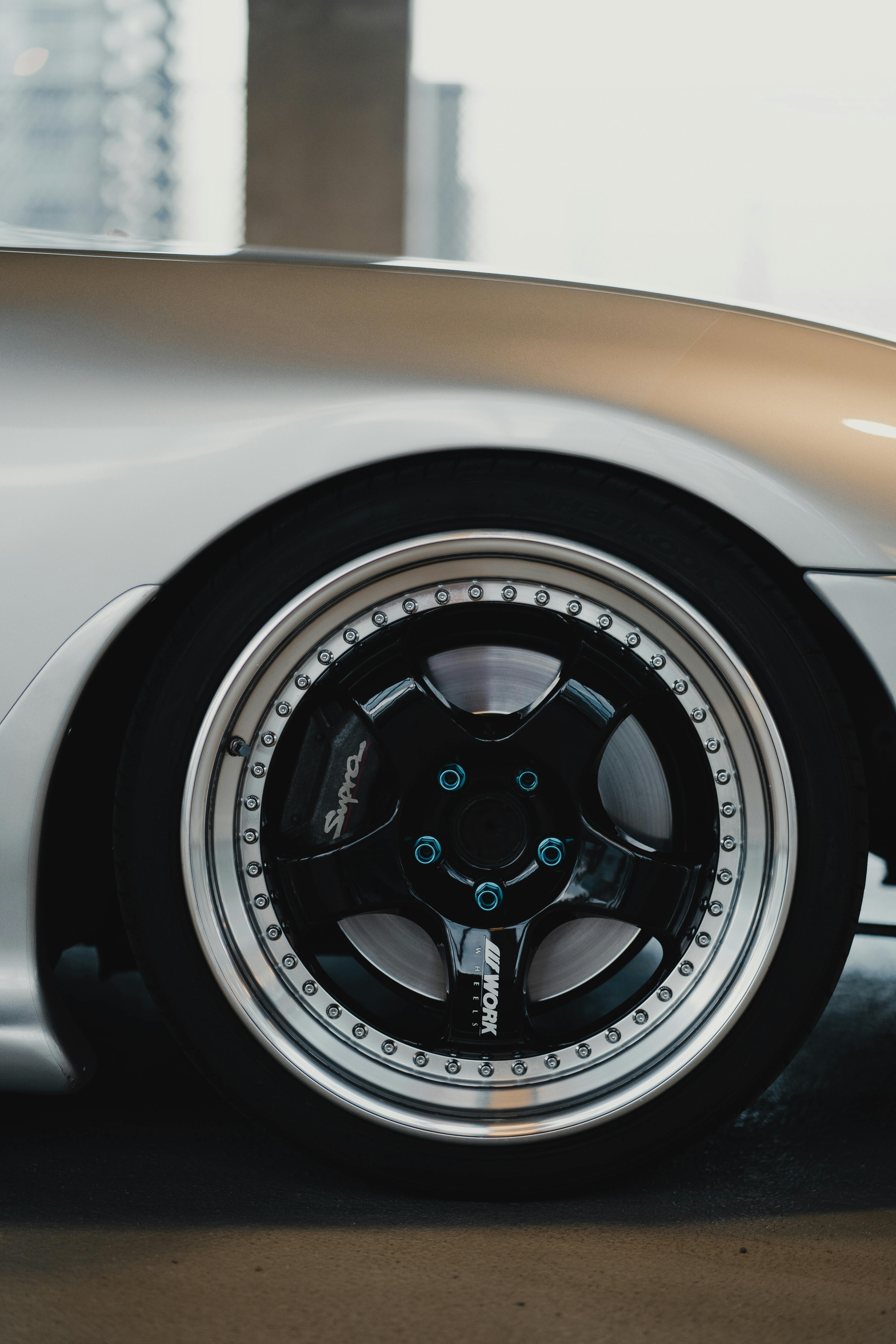 Close Up Photo of Black Car Rims · Free Stock Photo