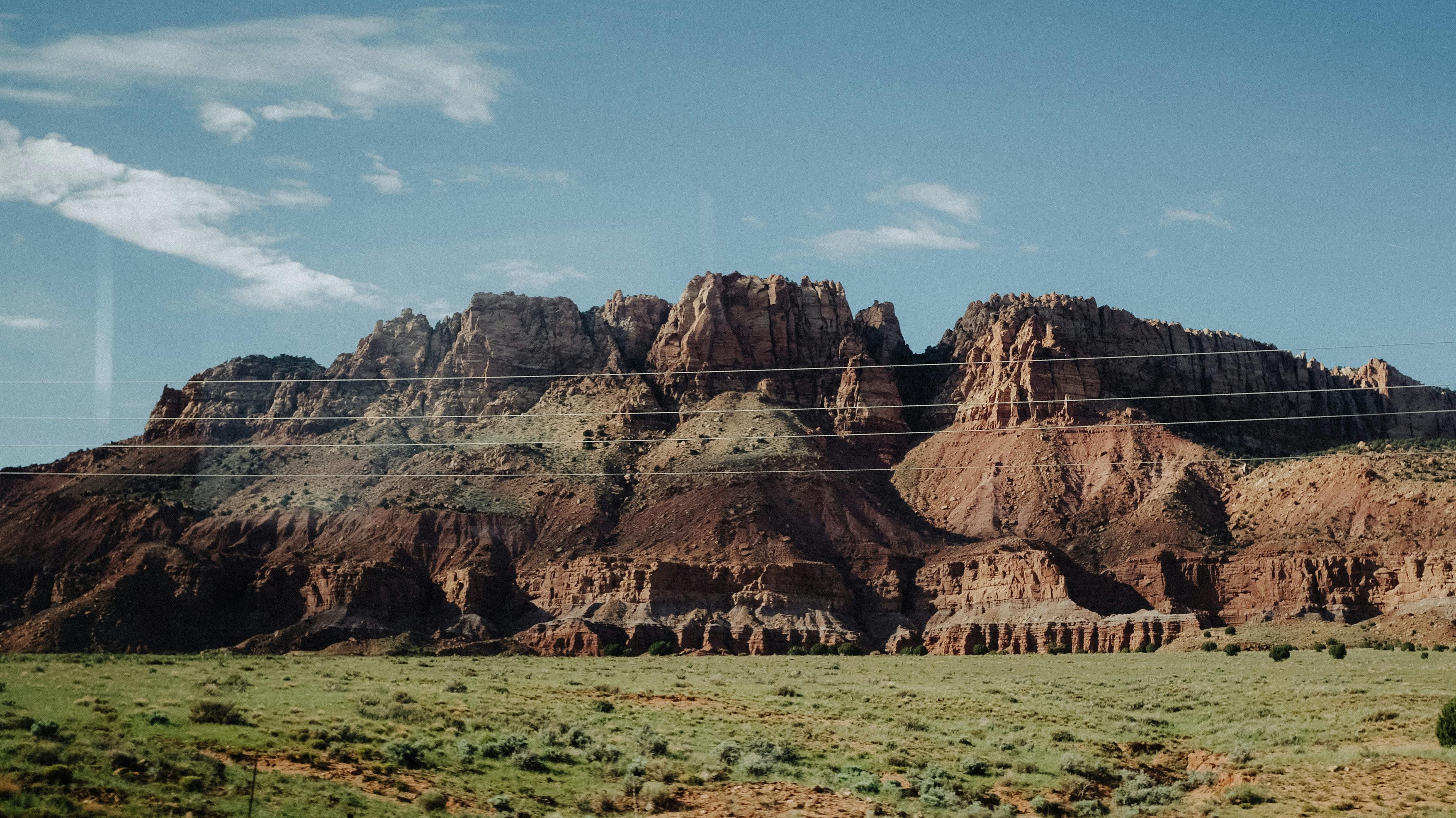 Brown Mountain Under Blue Sky · Free Stock Photo