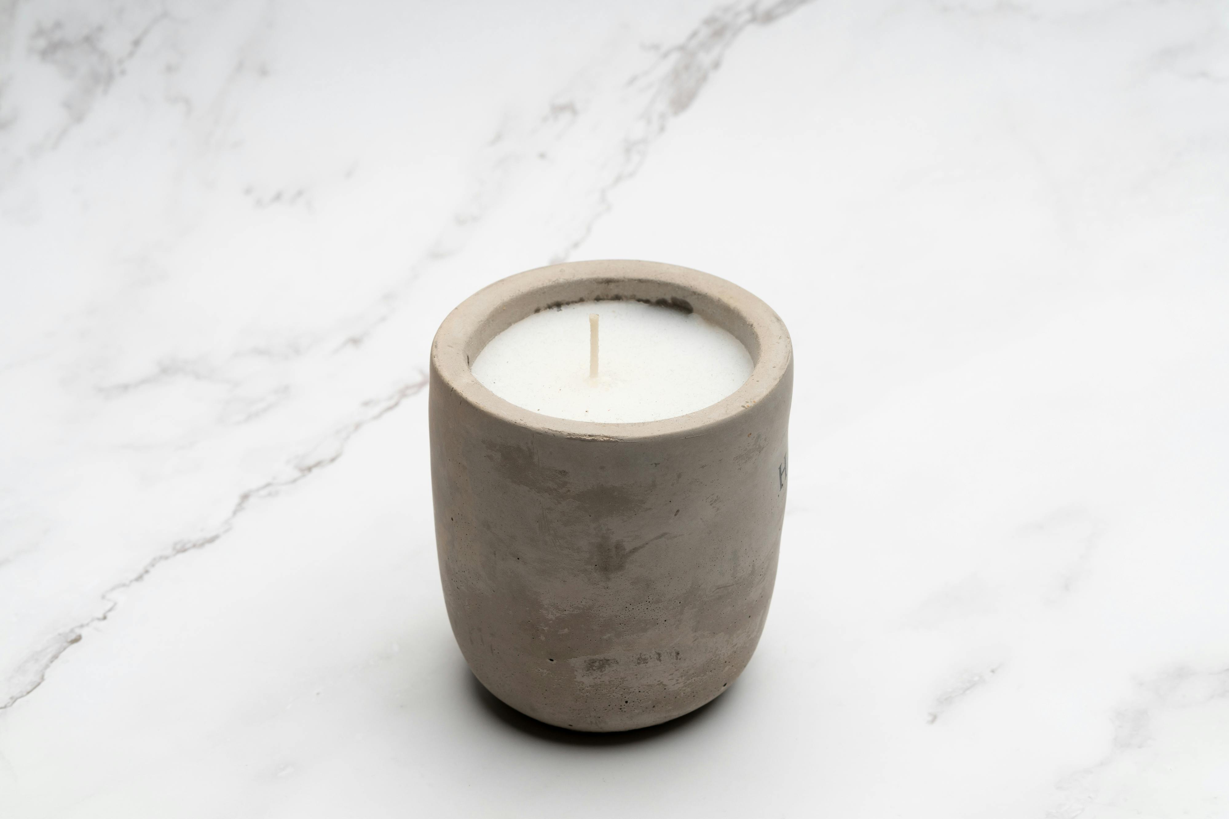 A Grayscale Photo of a Body Shaped Candle · Free Stock Photo