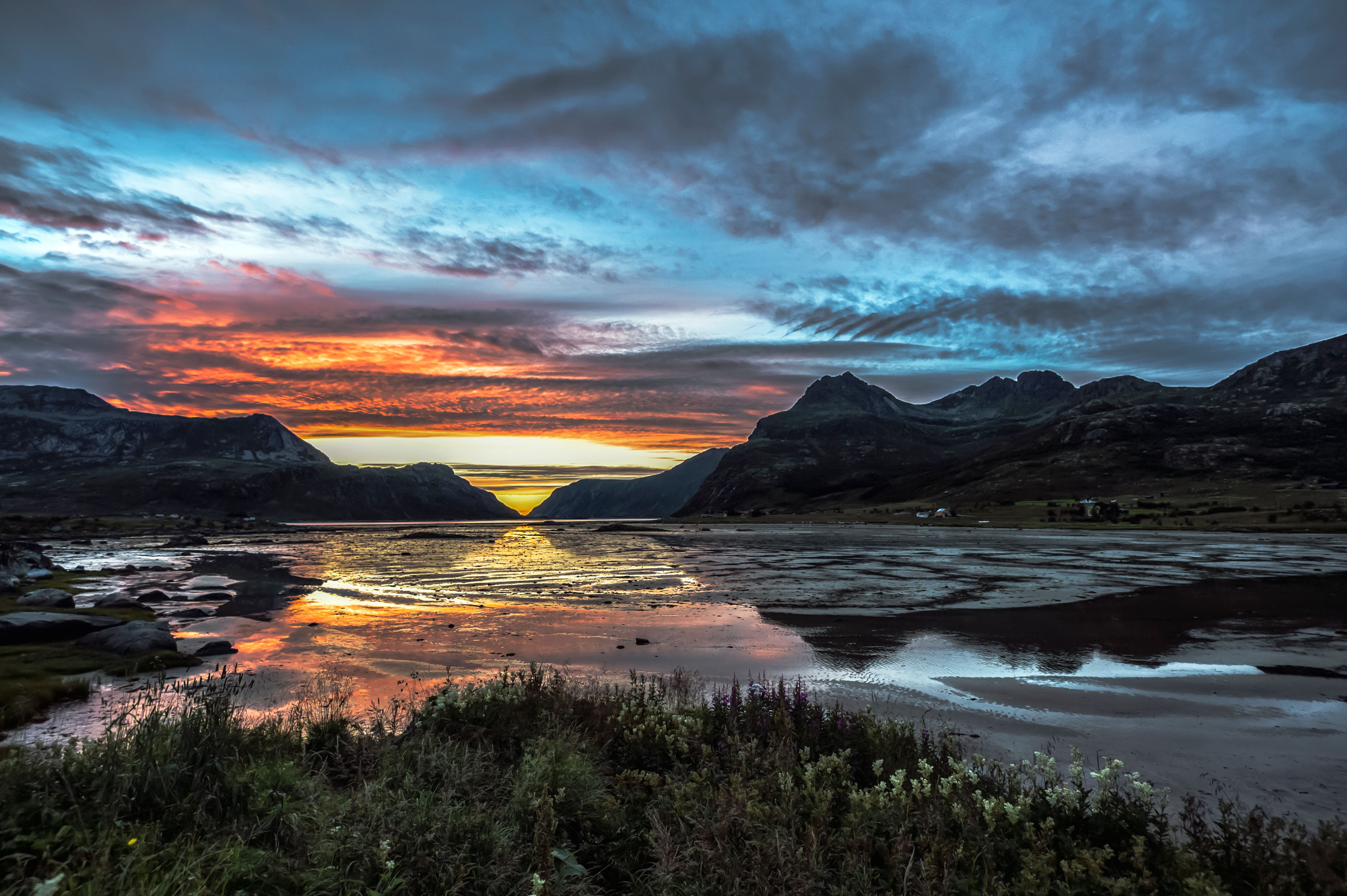 Dramatic Sunset over River and Mountains · Free Stock Photo