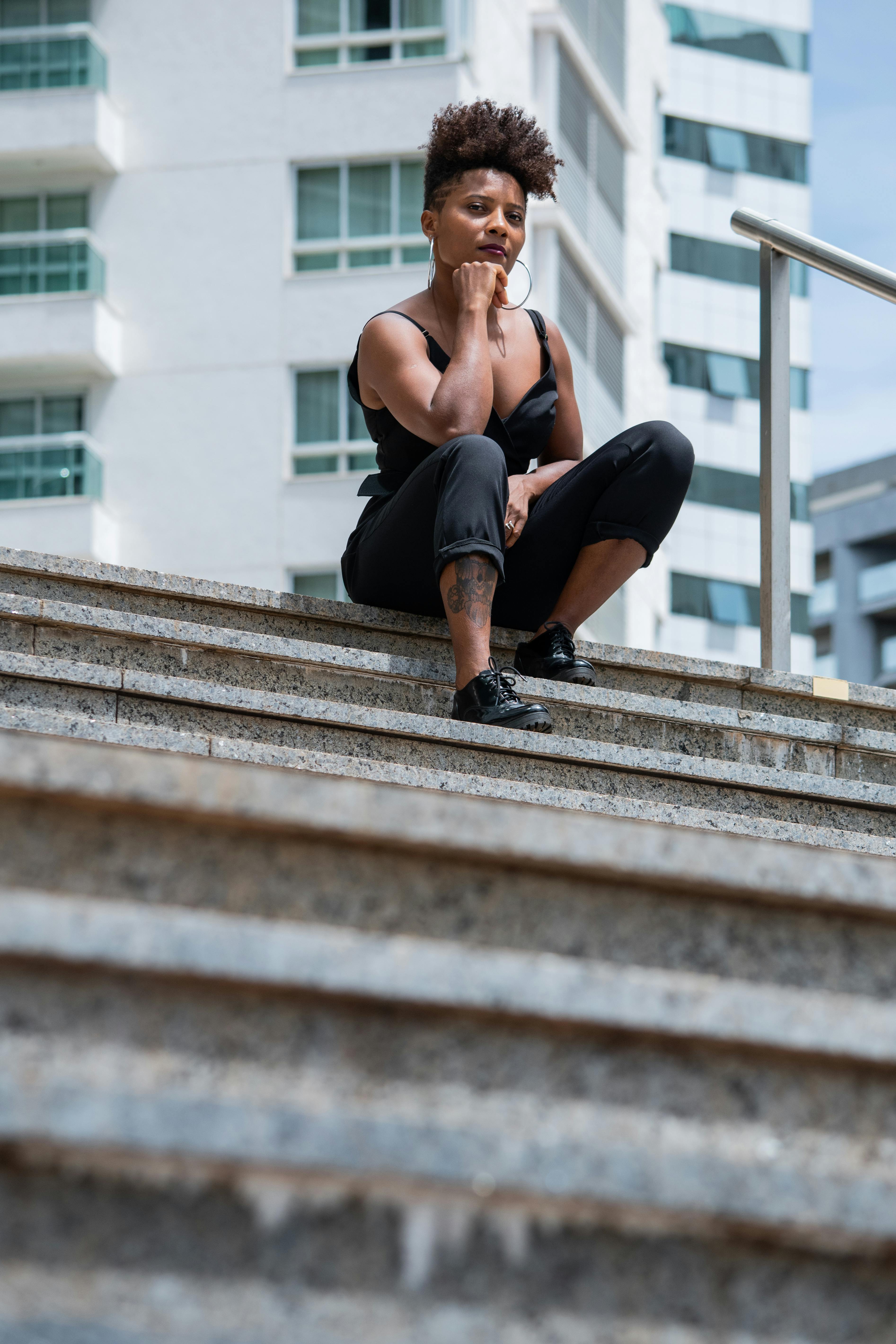 Woman Sitting on Top of Stairs · Free Stock Photo