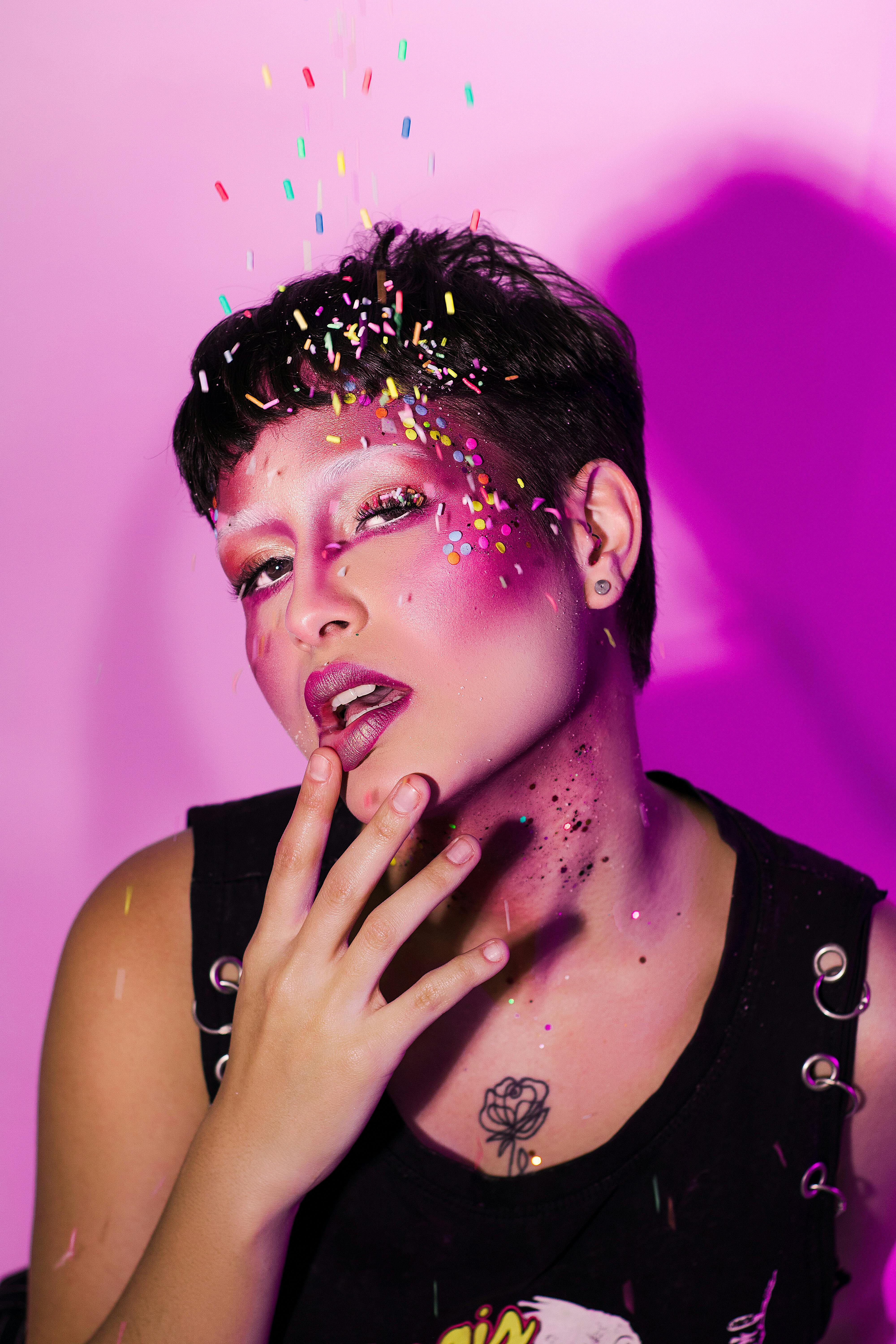 Woman in Creative Makeup Posing with Sprinkles Above Her Head · Free ...